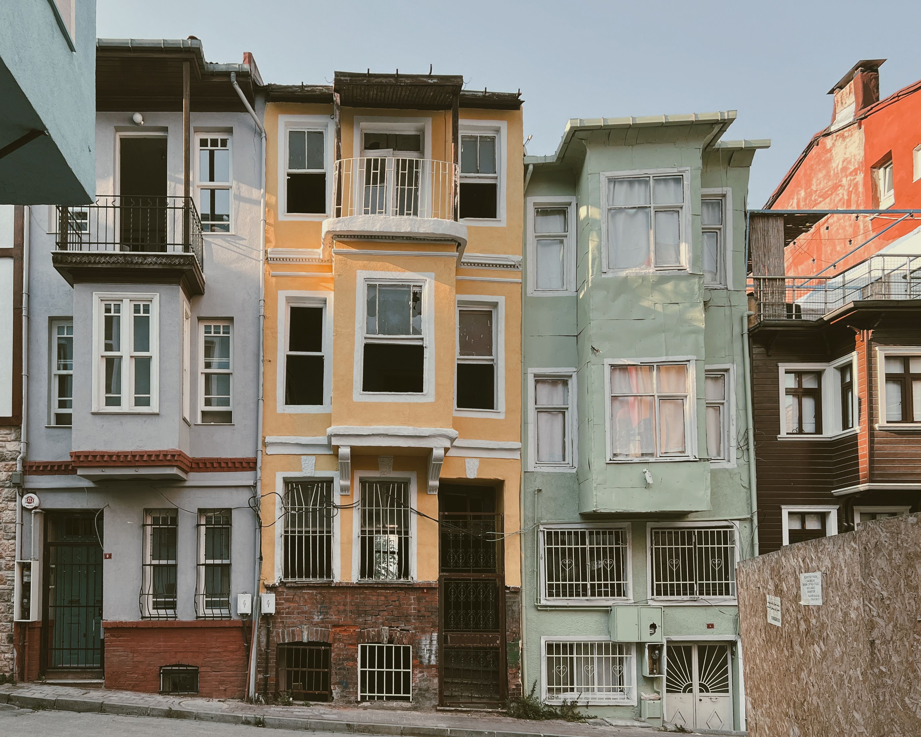 Colorful Buildings with Apartments near Street · Free Stock Photo