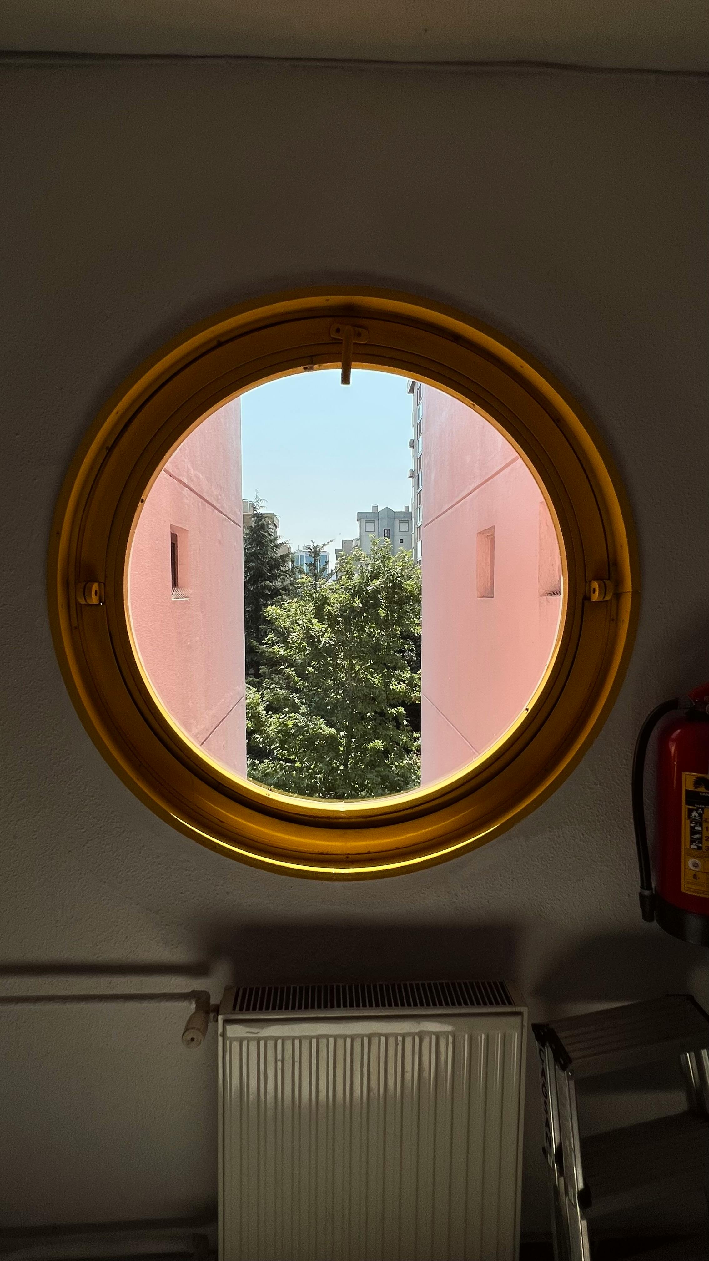Circular Window over Radiator · Free Stock Photo
