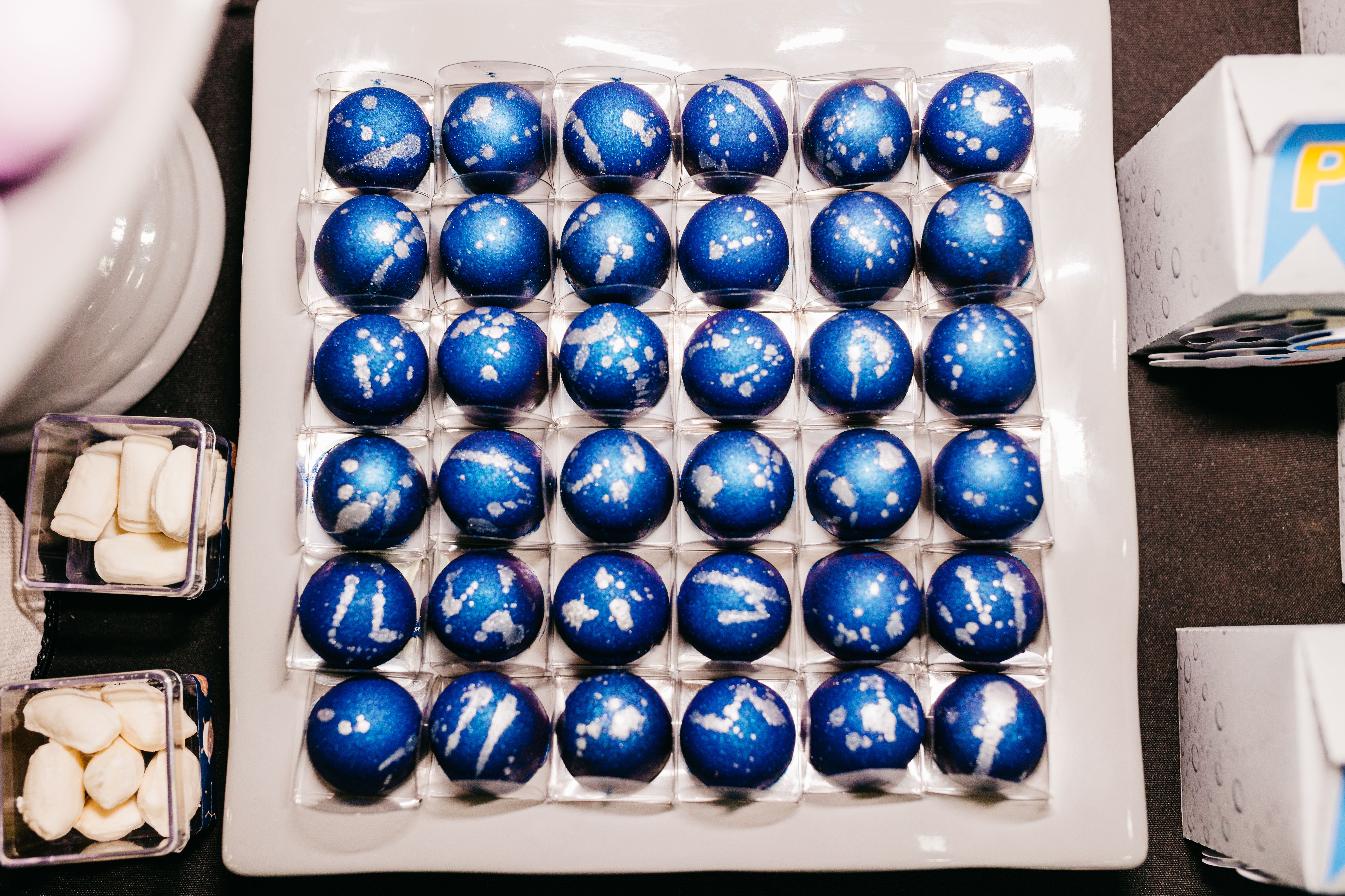 Space-Themed Blue Balls in Box · Free Stock Photo