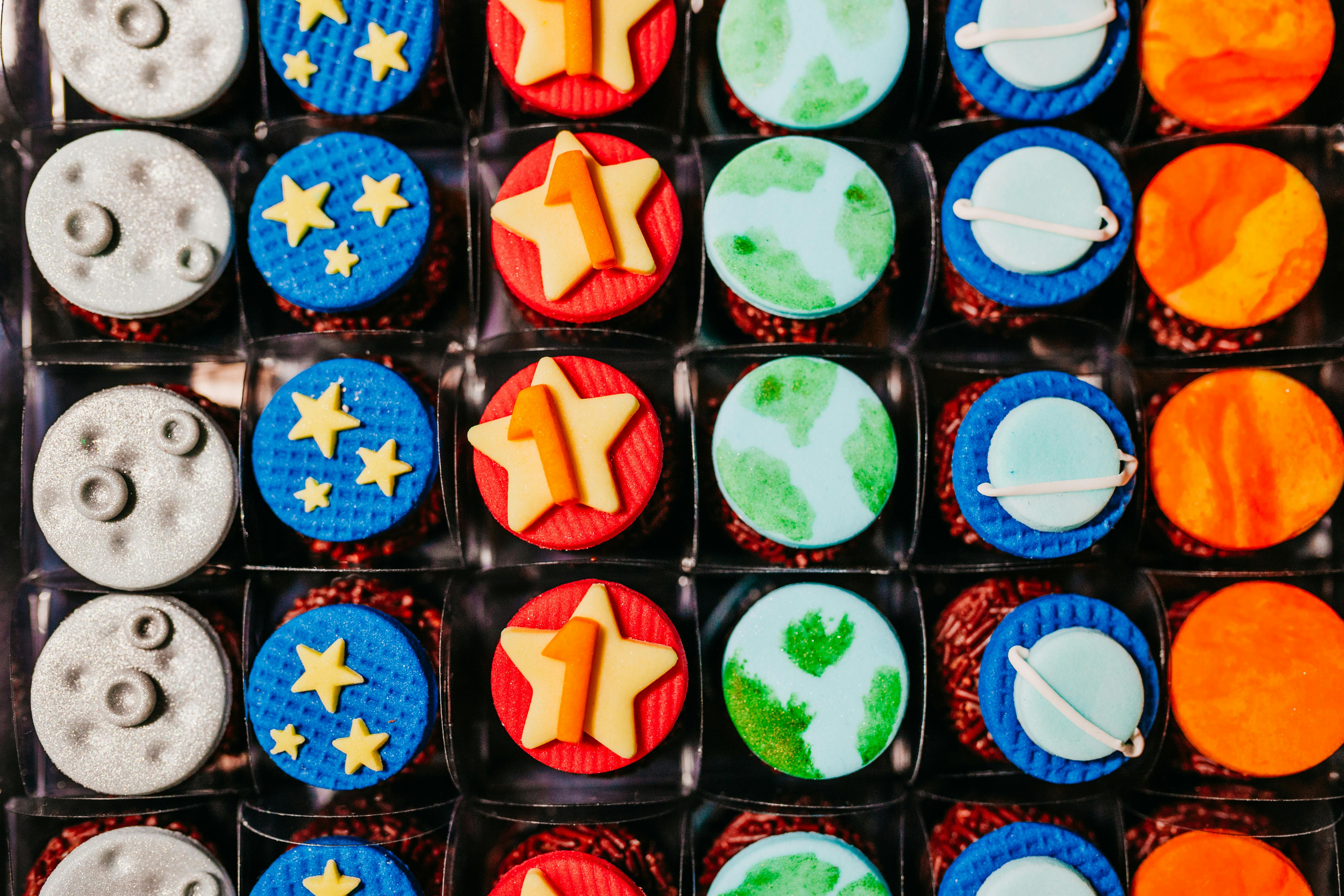 Space-Themed Cupcakes in Box · Free Stock Photo