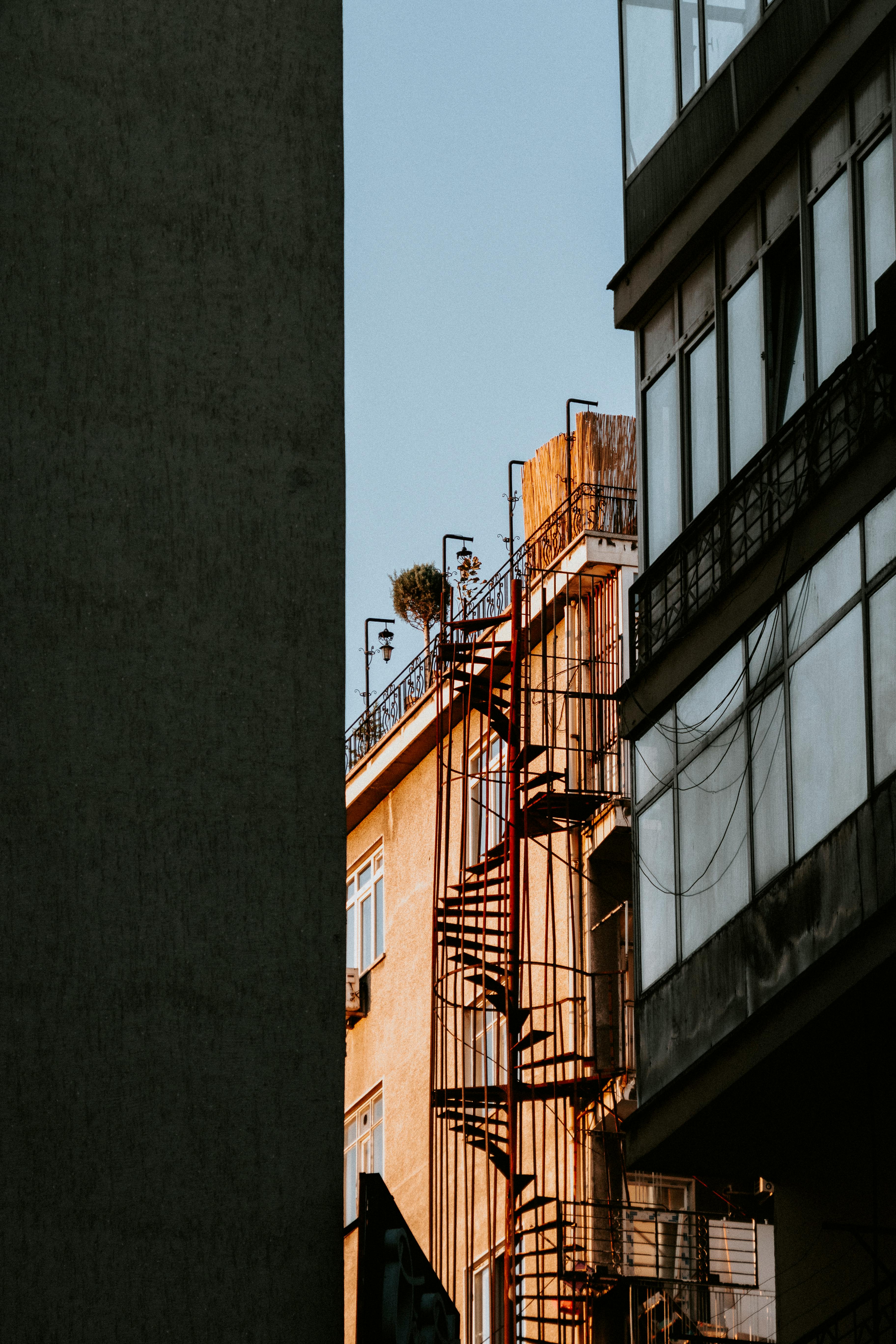 Spiral Fire Escape outside an Apartment Building · Free Stock Photo
