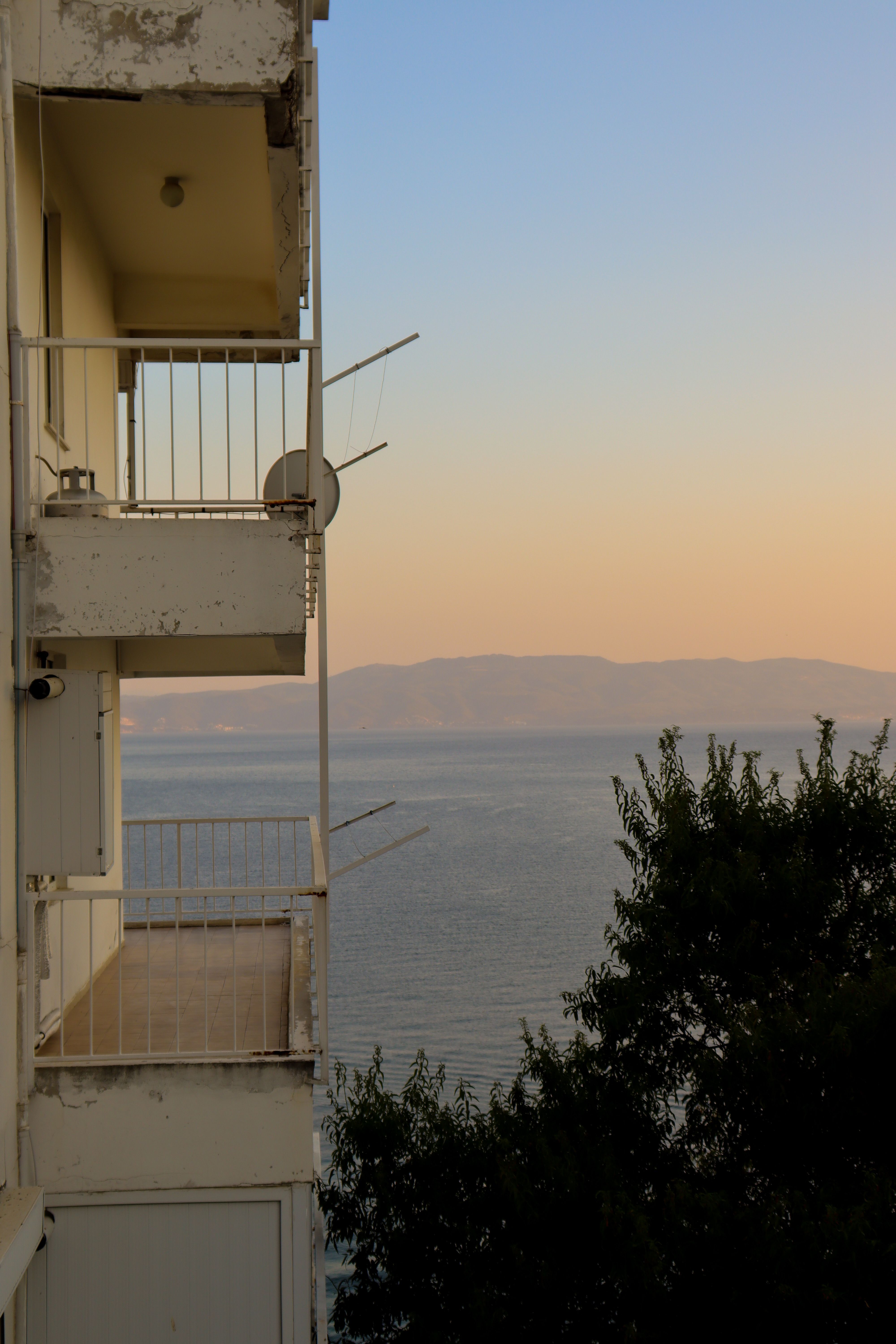 View of the Sunset over the Sea from a Balcony · Free Stock Photo