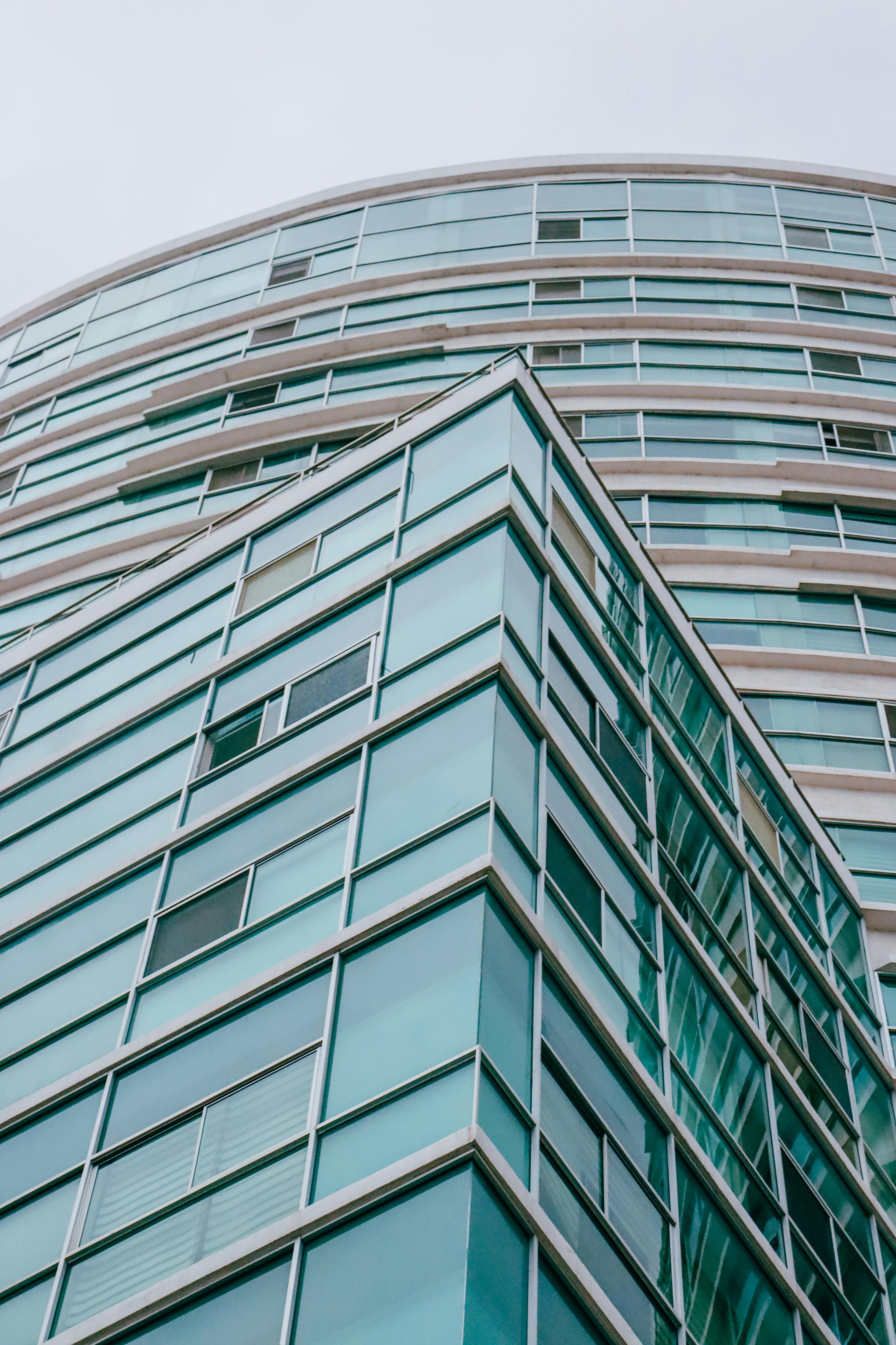 Skyscraper Building behind Windows · Free Stock Photo