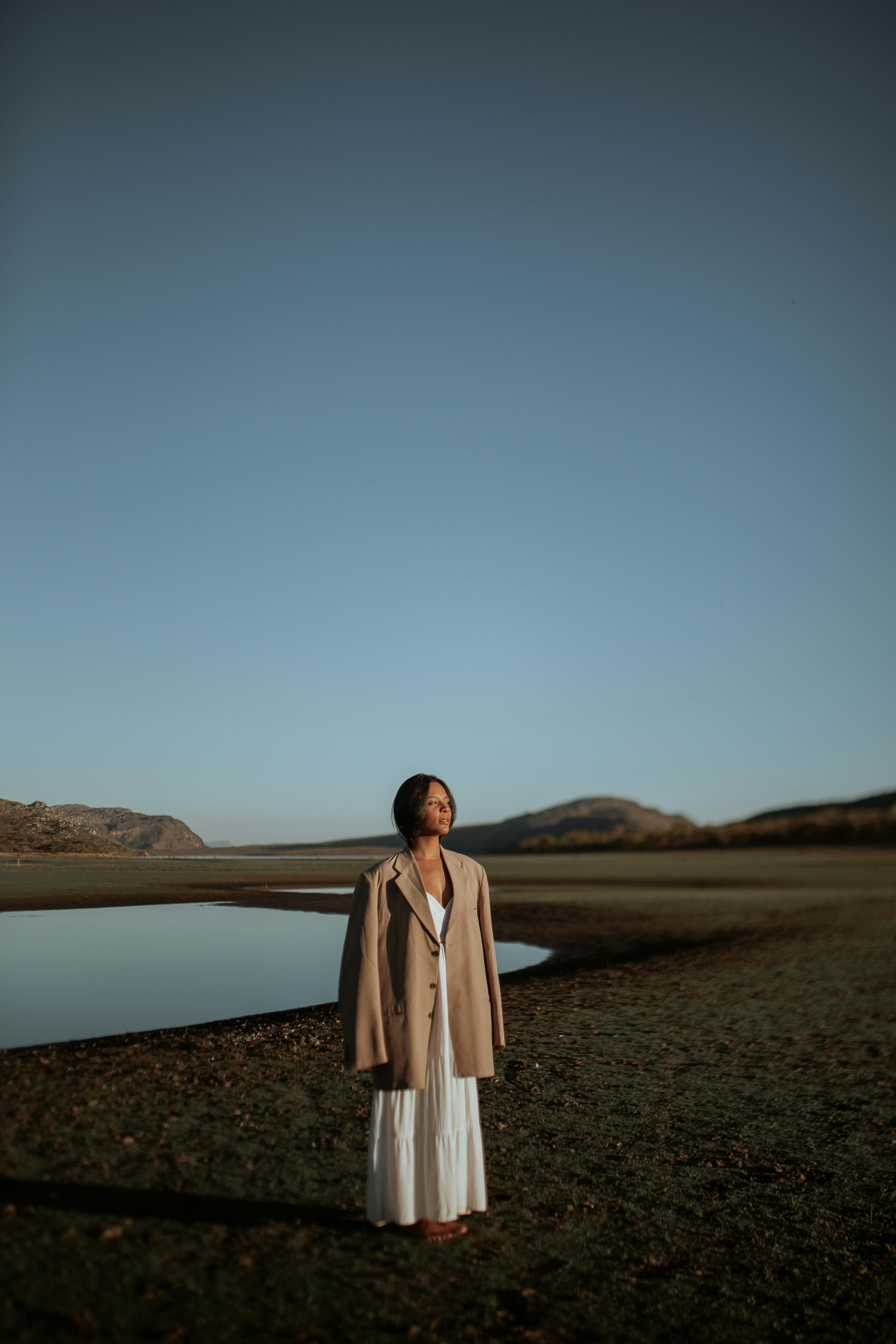 Woman Posing with Sun between Hands · Free Stock Photo