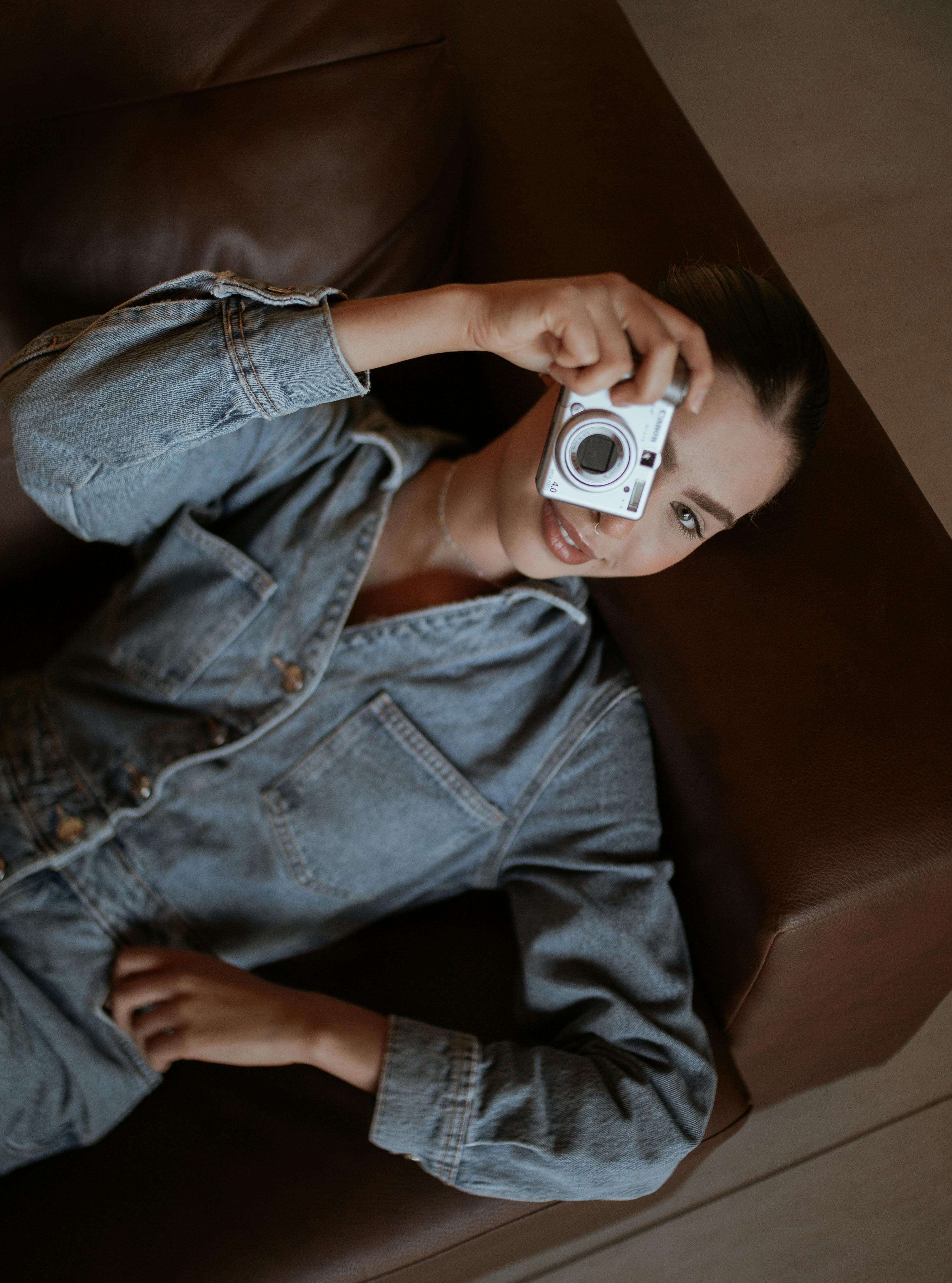 Woman Lying Down and Posing with Camera · Free Stock Photo