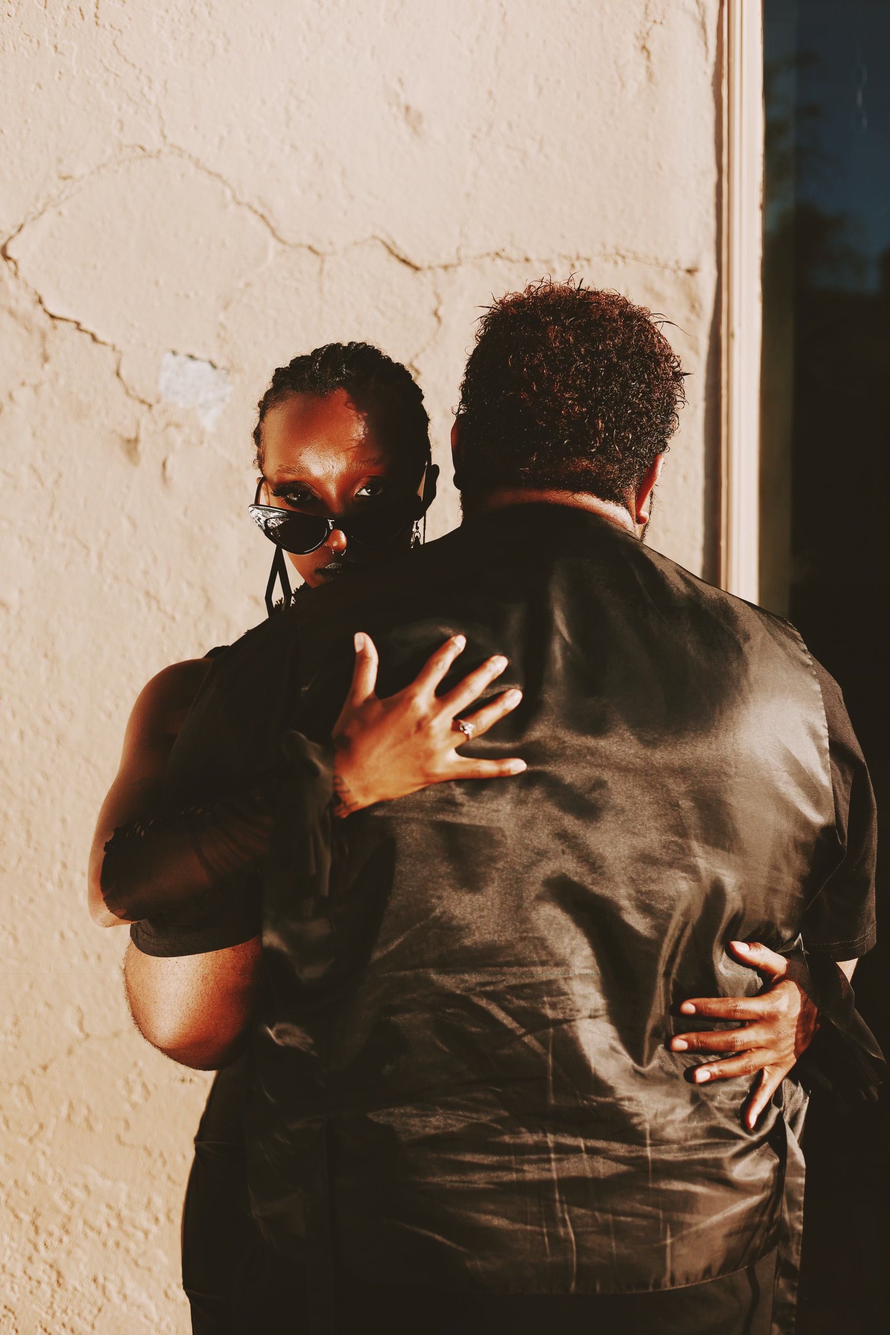 Man in Leather Jacket Hugging Woman · Free Stock Photo