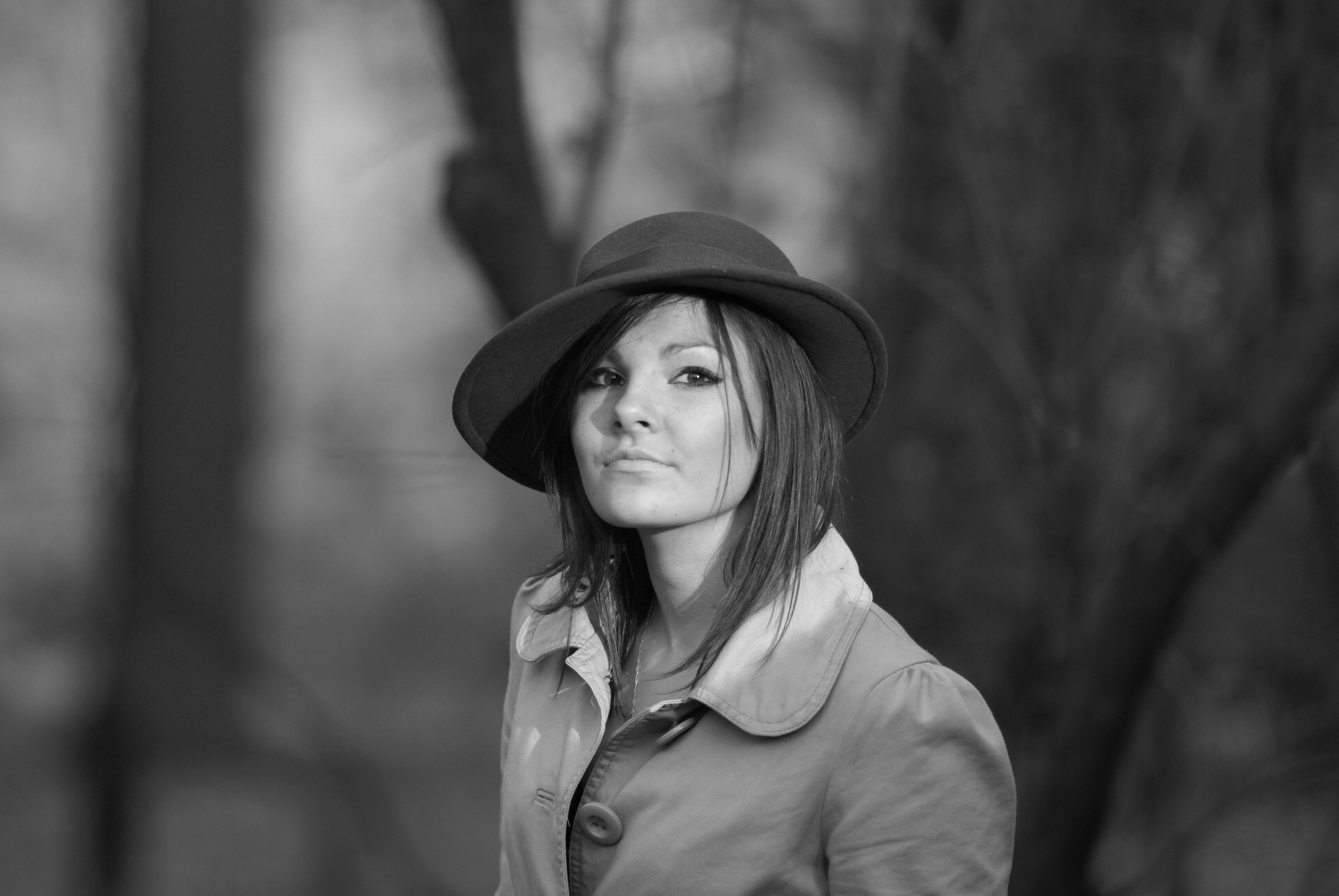 A Woman in a Coat Praying · Free Stock Photo