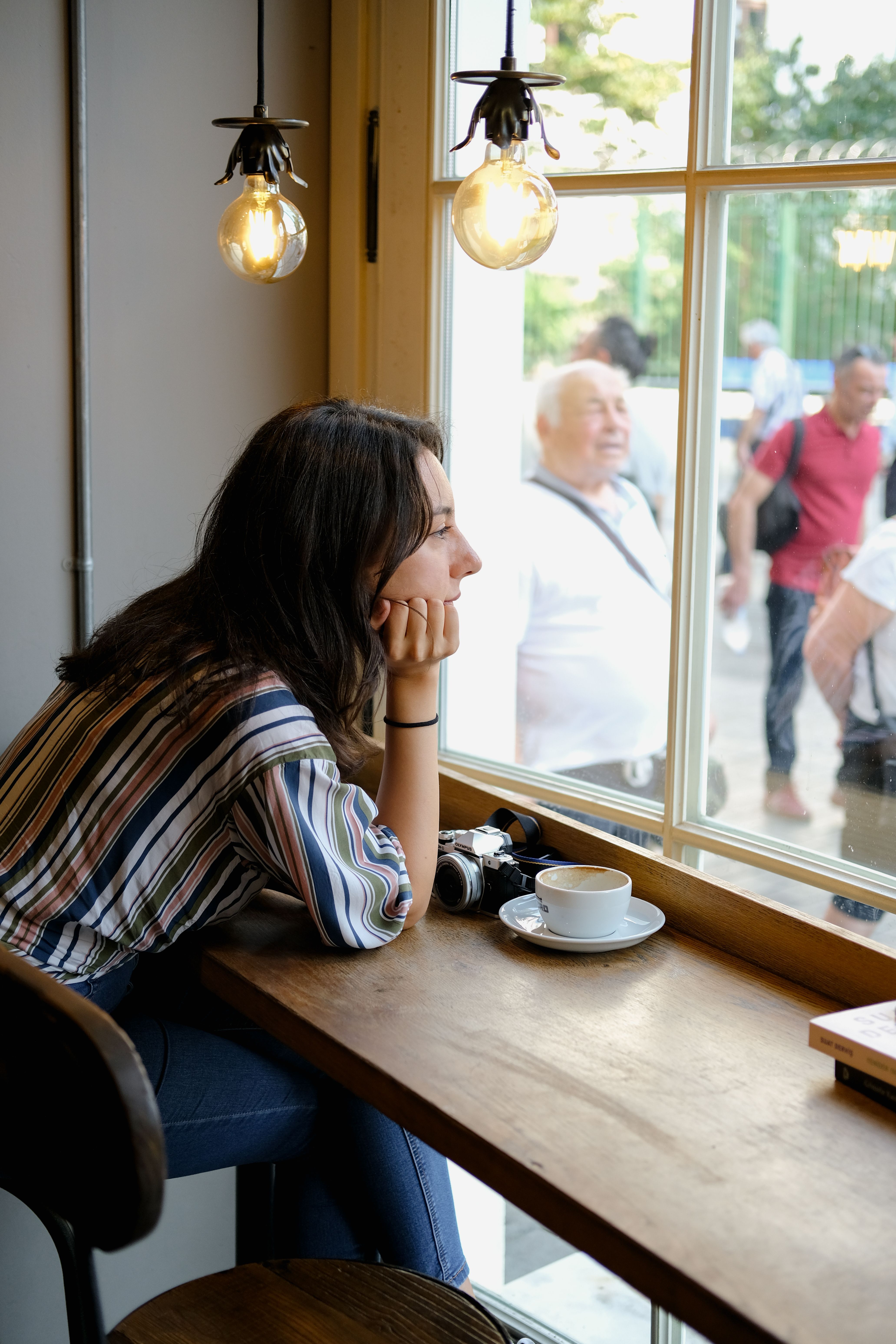 A Woman Sitting in a Cafe by the Window · Free Stock Photo