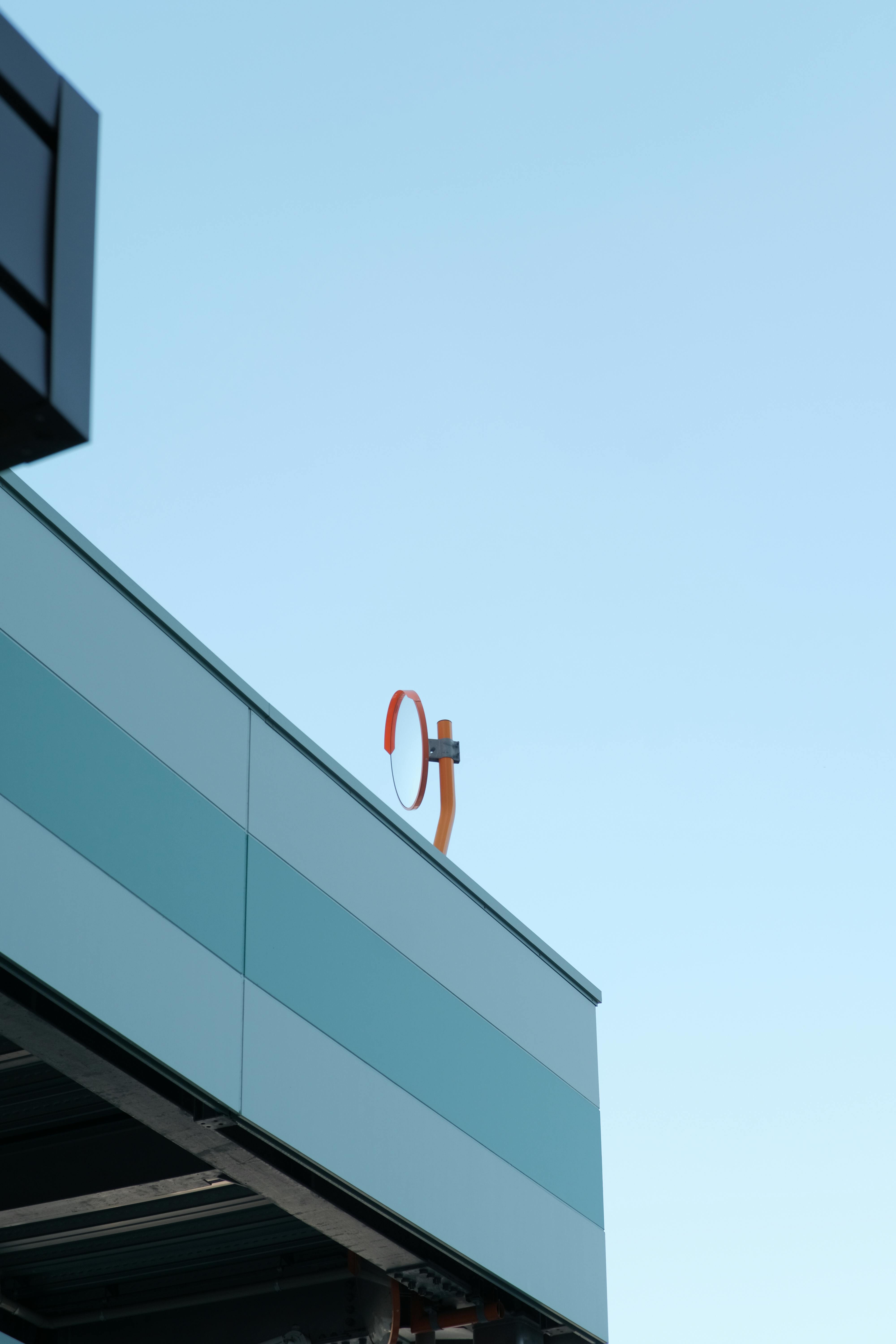 Ring on Building Roof · Free Stock Photo