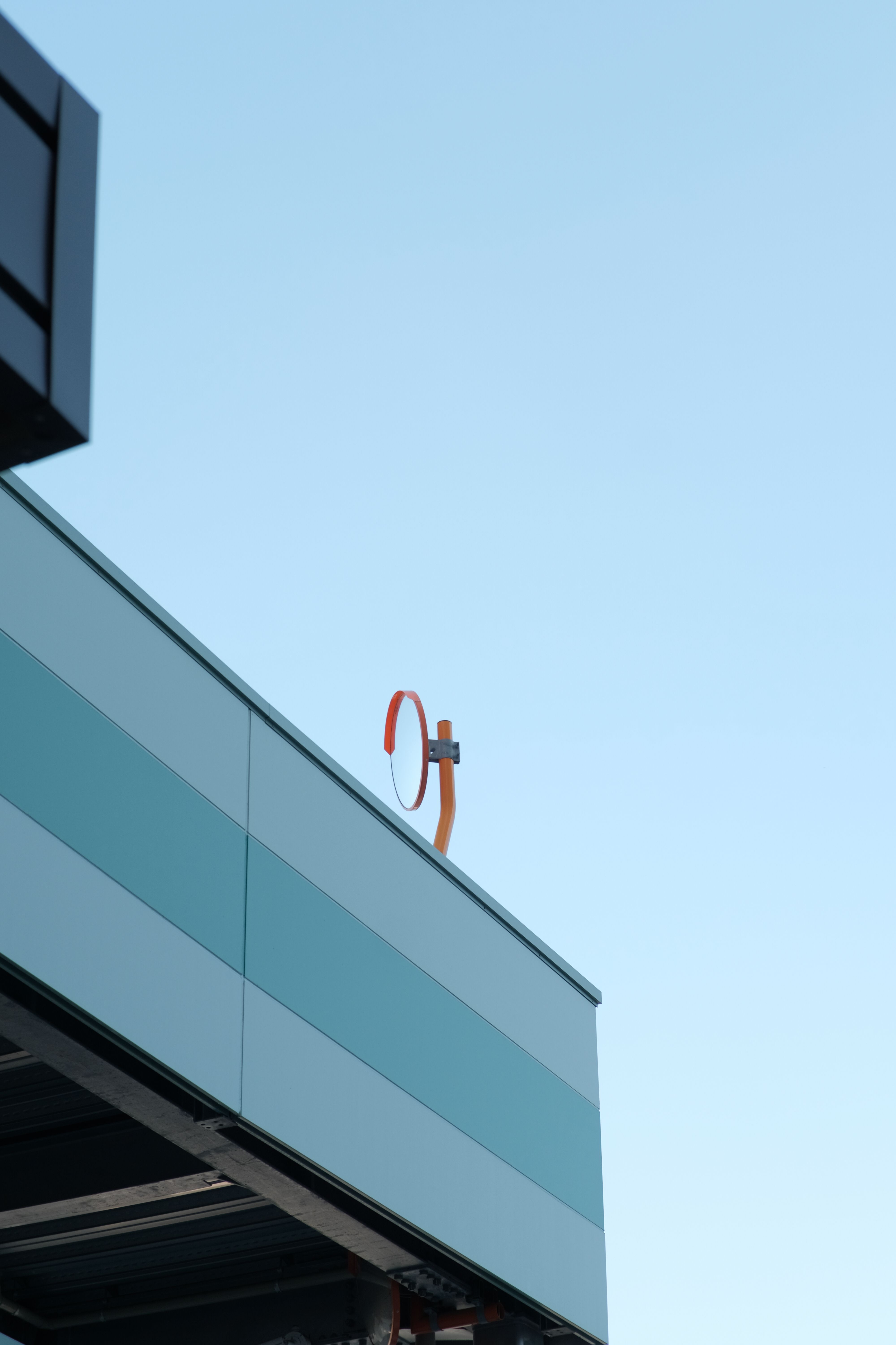 Ring on Building Roof · Free Stock Photo