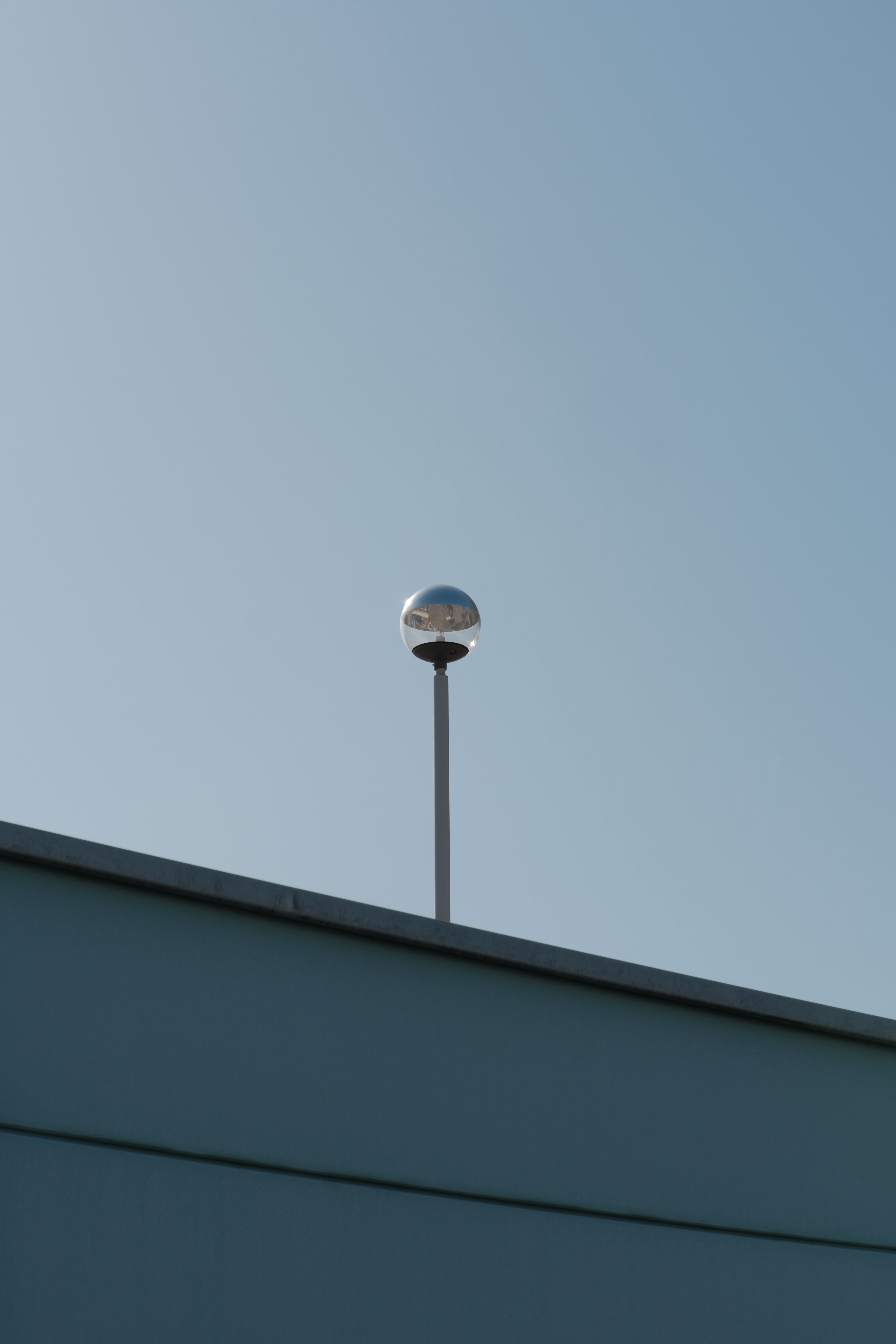 Lamp on Building Roof · Free Stock Photo