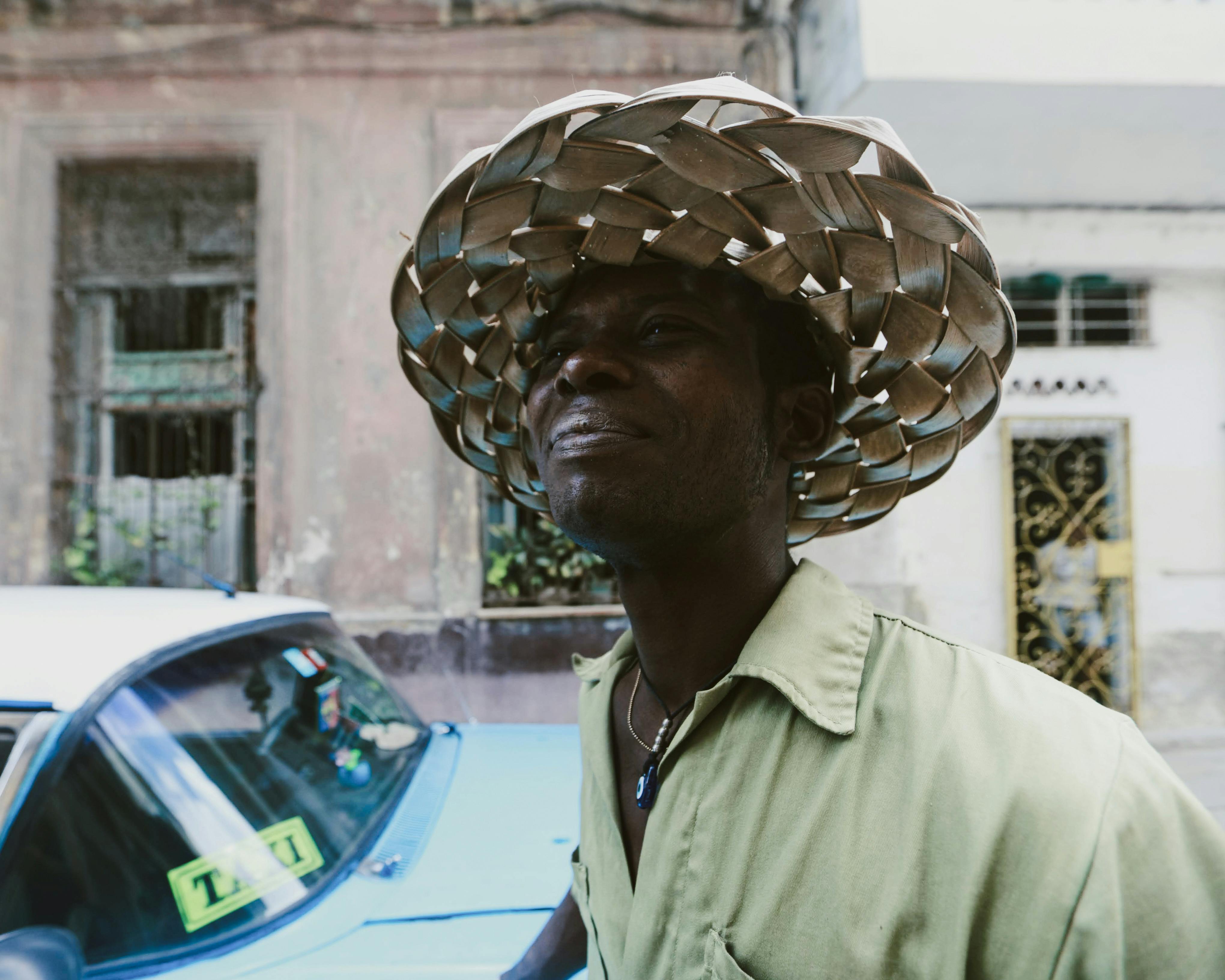 Smiling Man in Wicker Sun Hat · Free Stock Photo