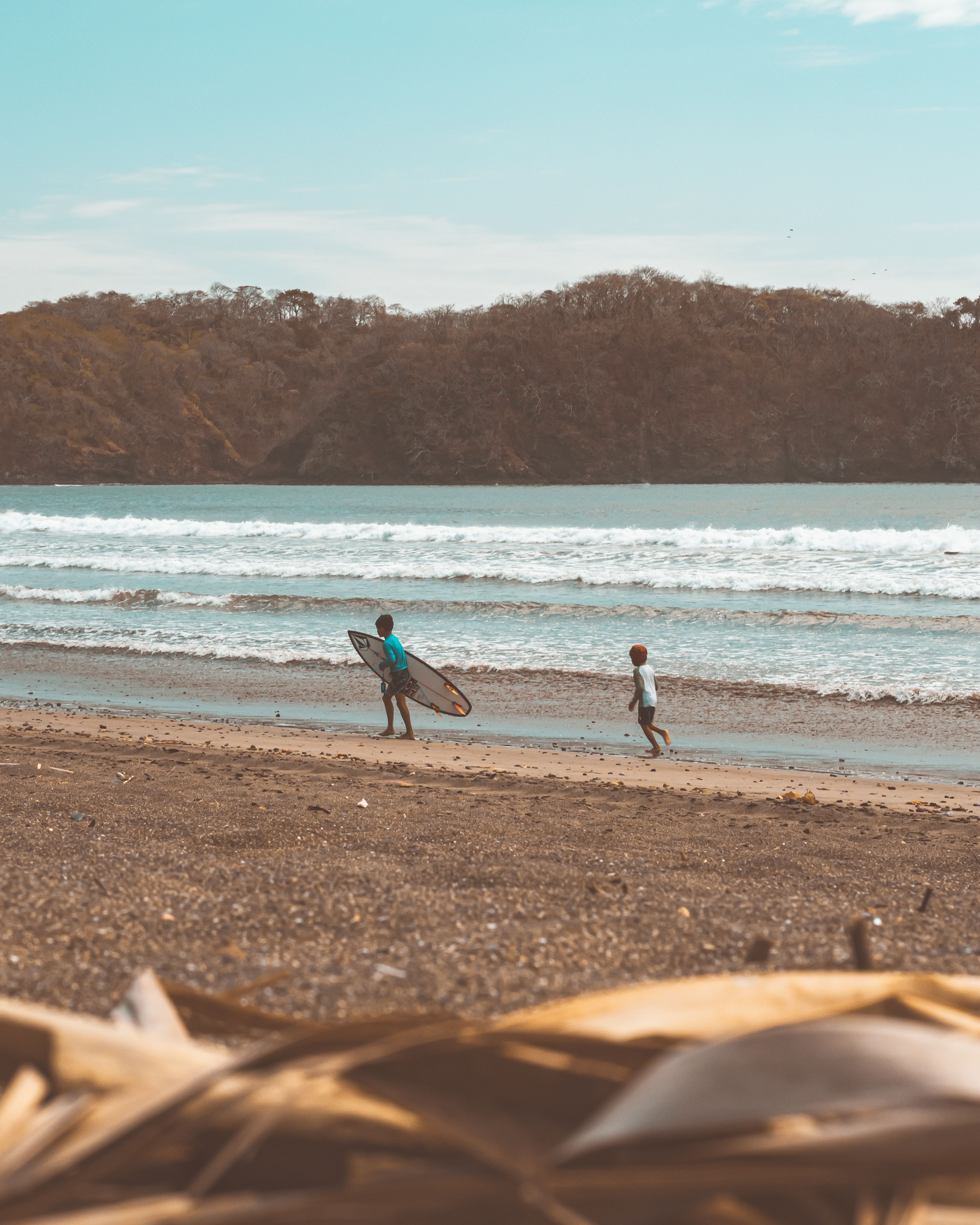 Children Playing with Surfboard on Sea Shore · Free Stock Photo