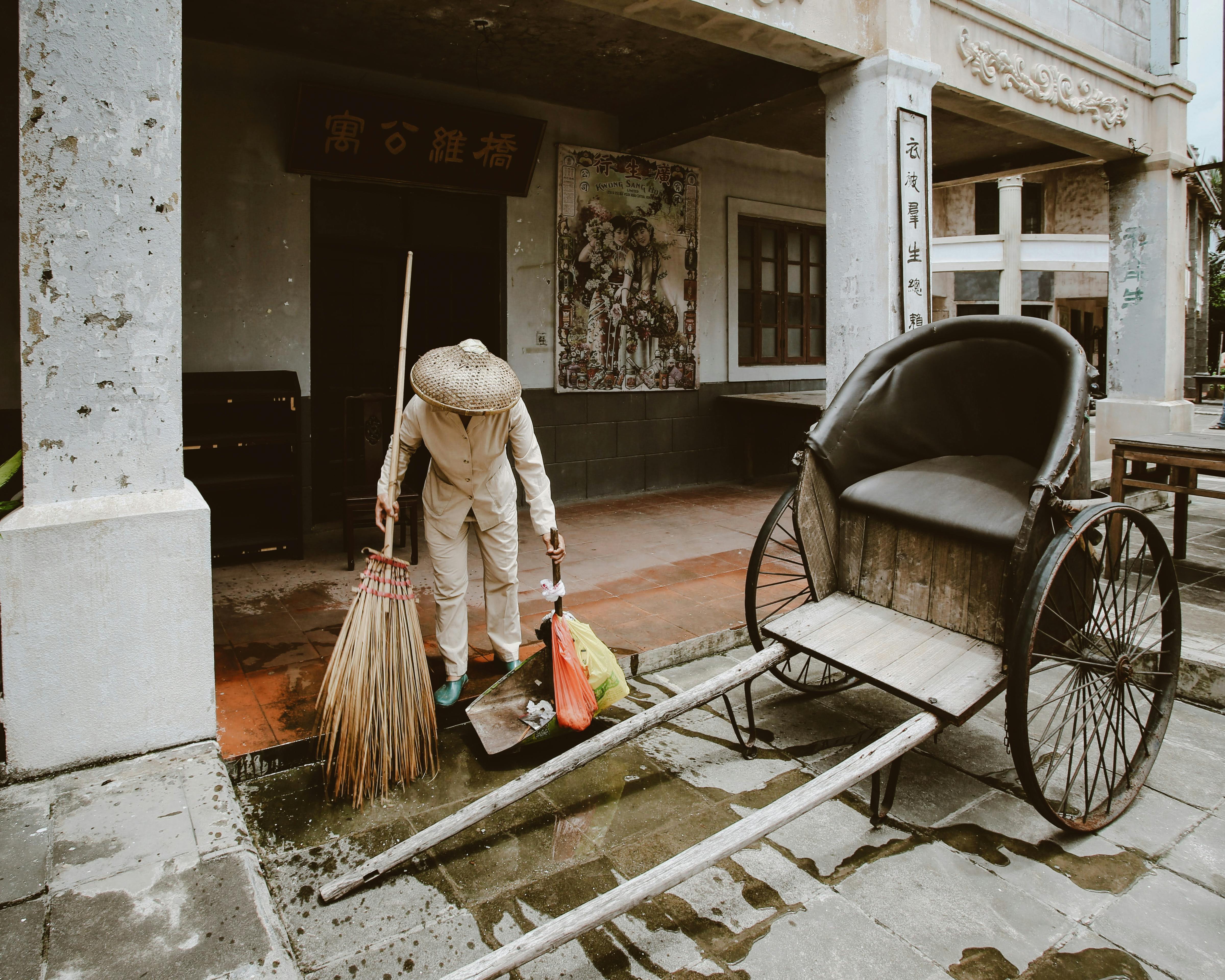 Street Sweeper in a Bamboo Hat Next to Traditional Chinese Rickshaw ...