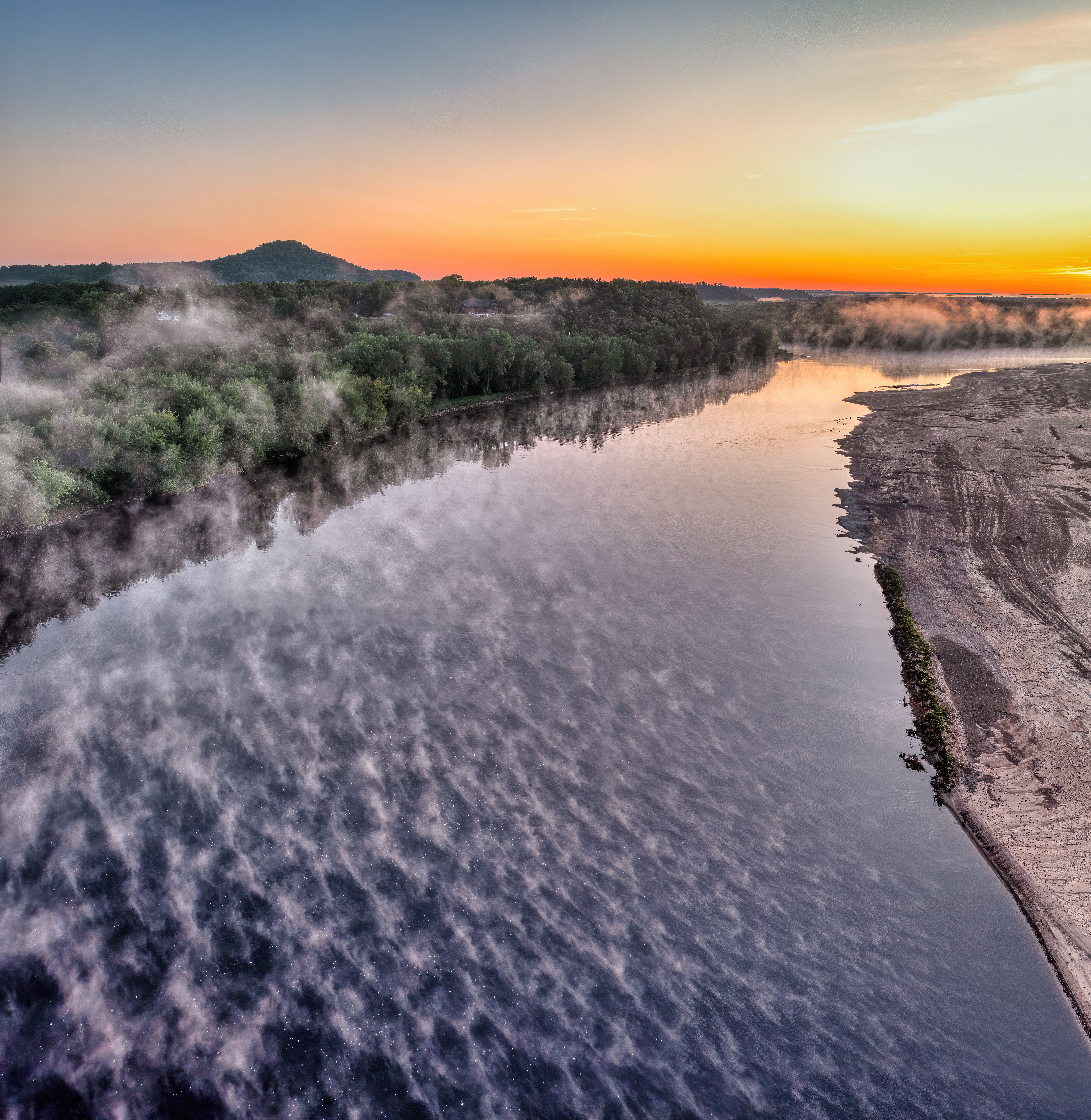 Clouds over River on Plains at Sunset · Free Stock Photo