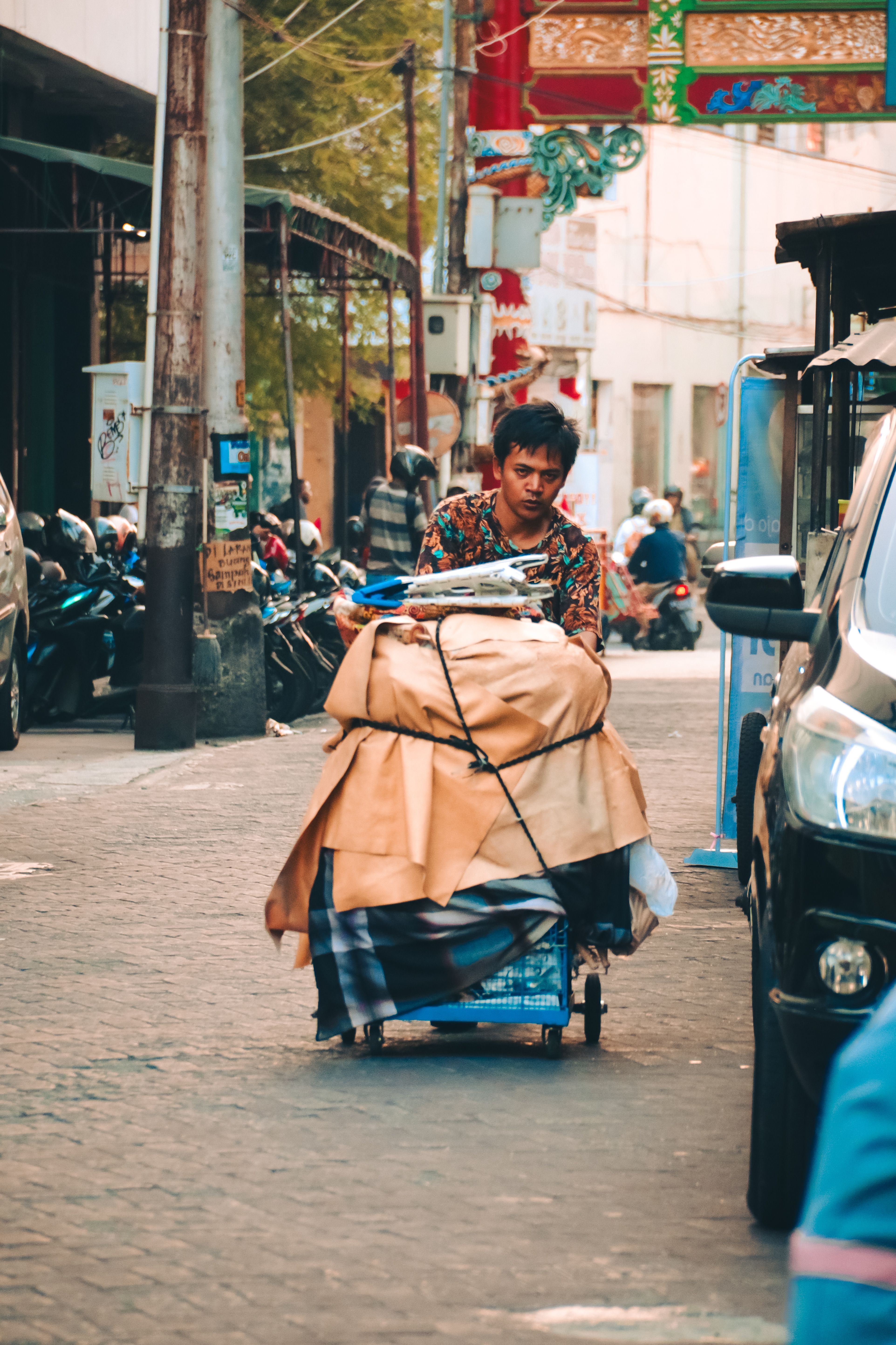 Silhouette of a Person Pushing a Trolley · Free Stock Photo