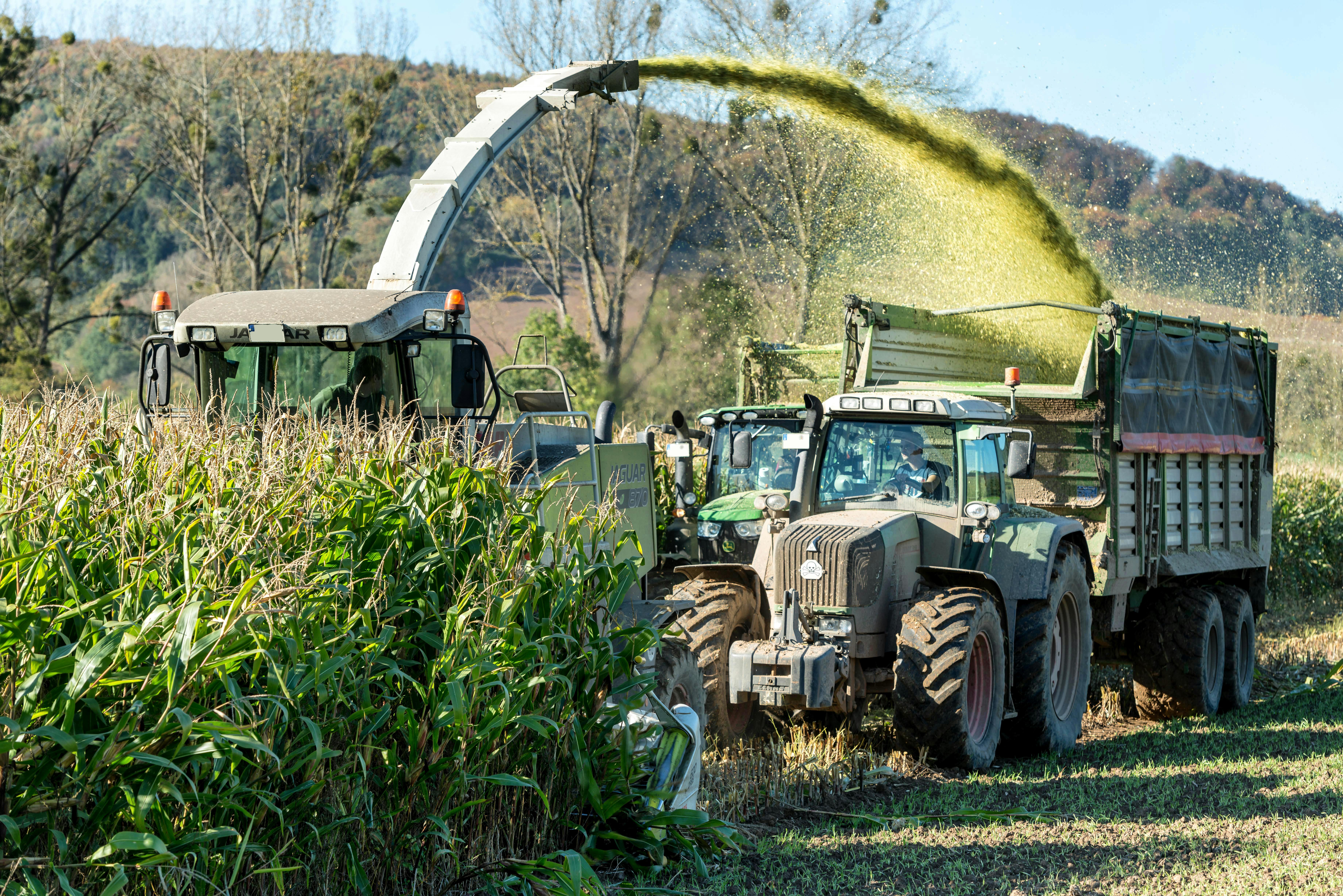 Harvester and Tractor on Field · Free Stock Photo