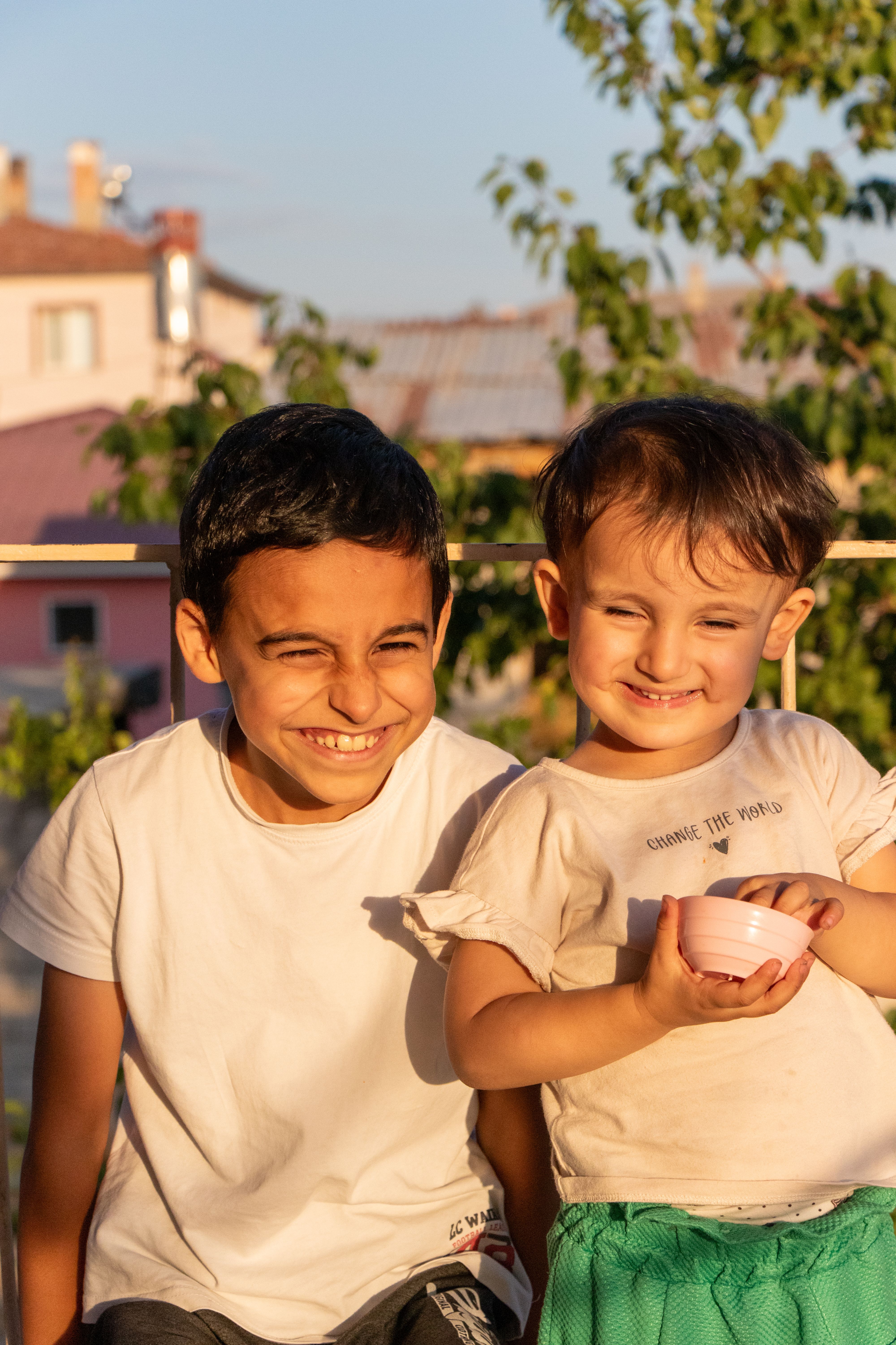 Smiling Siblings in White T-shirts · Free Stock Photo