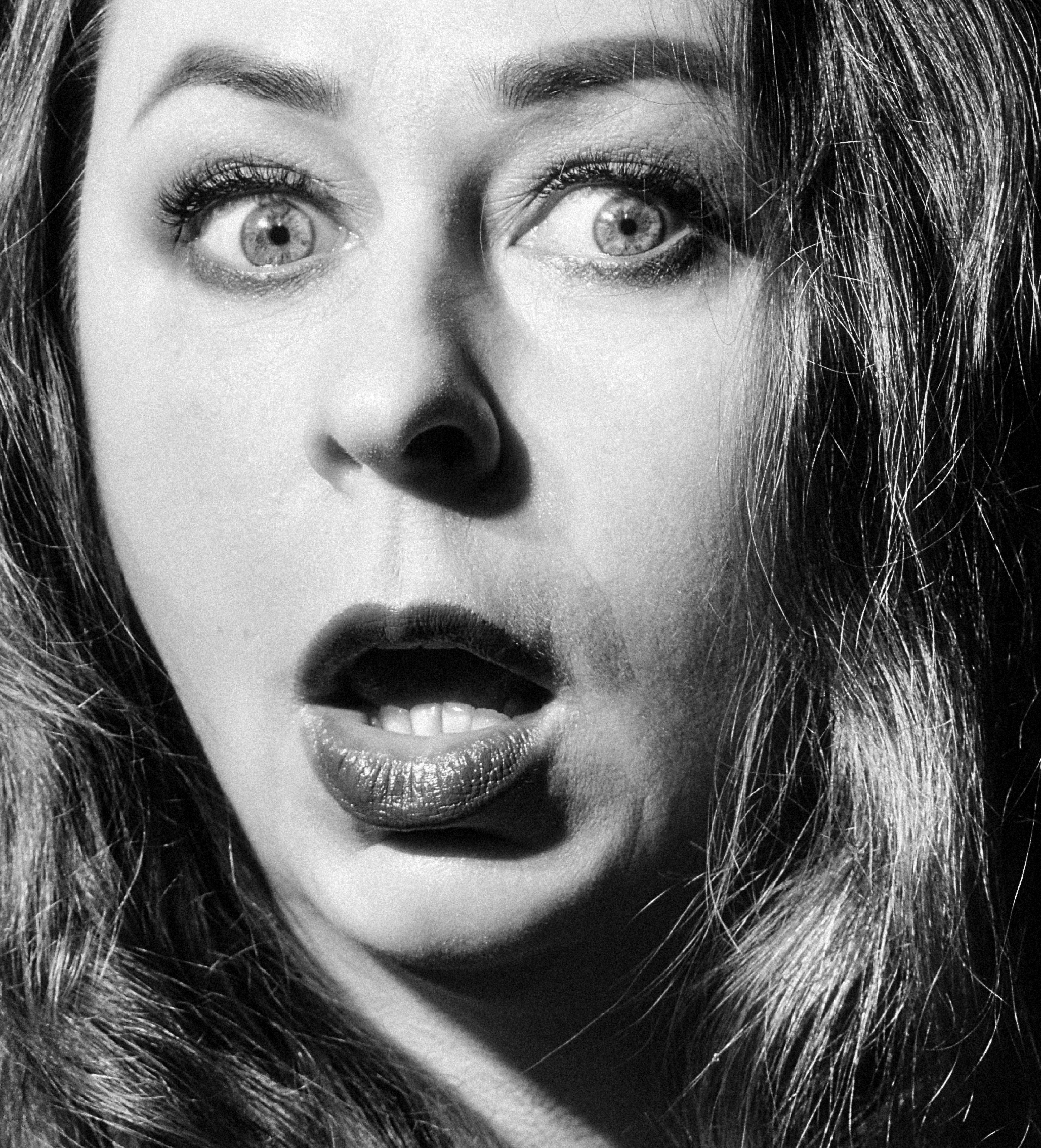 Black and White Photo of a Woman Feigning Fear · Free Stock Photo