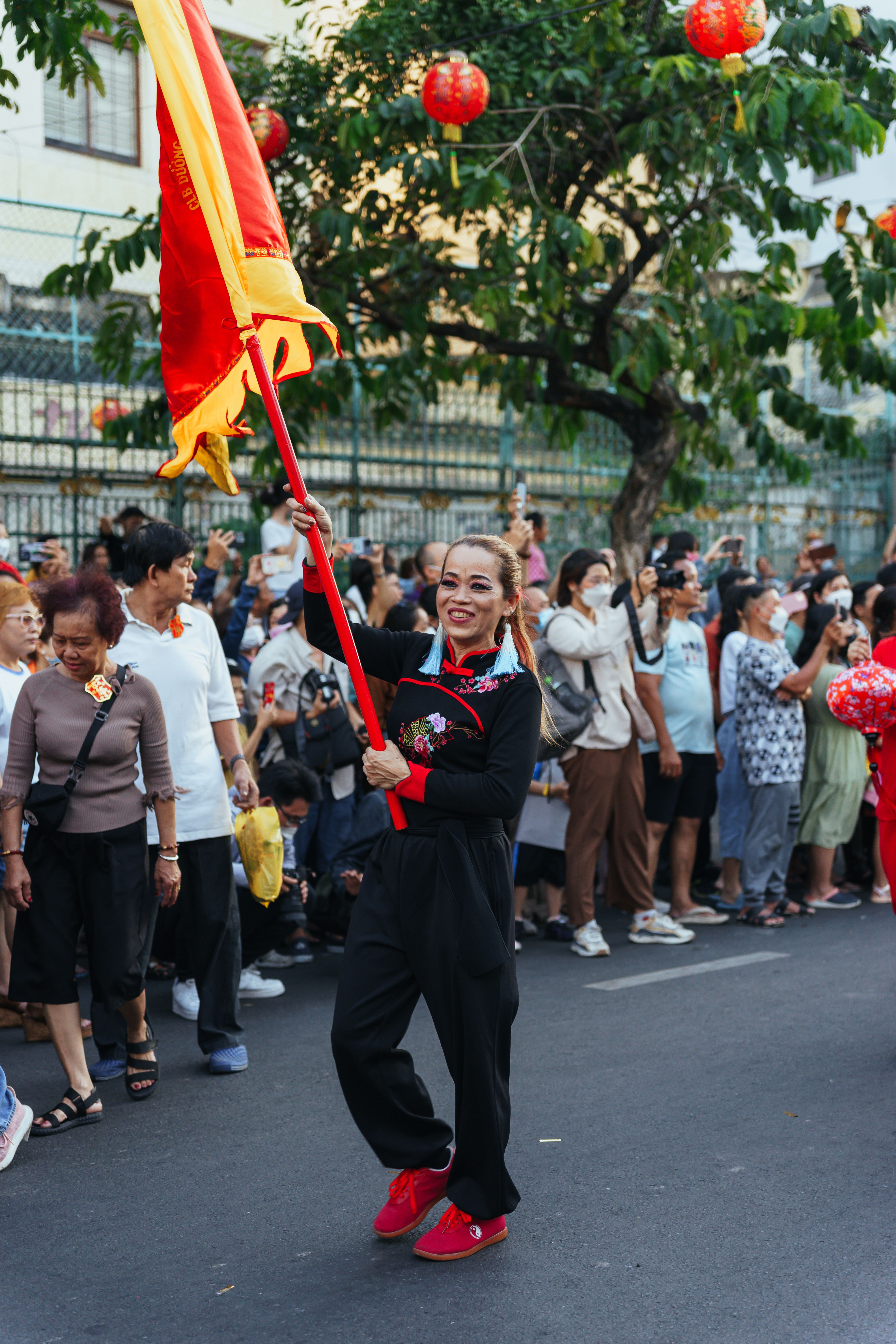 Woman Walking and Holding Flag at Parade · Free Stock Photo