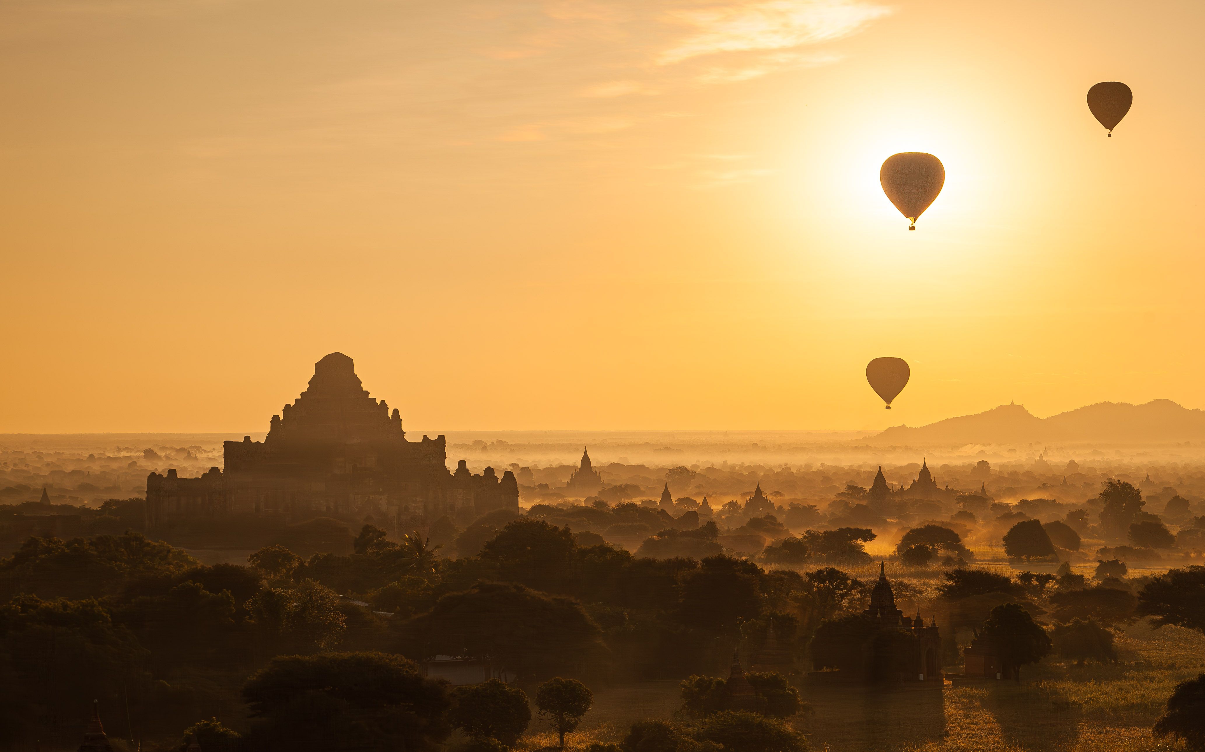 Hot Air Balloons Flying above Buddhist Temple at Sunrise in Myanmar ...