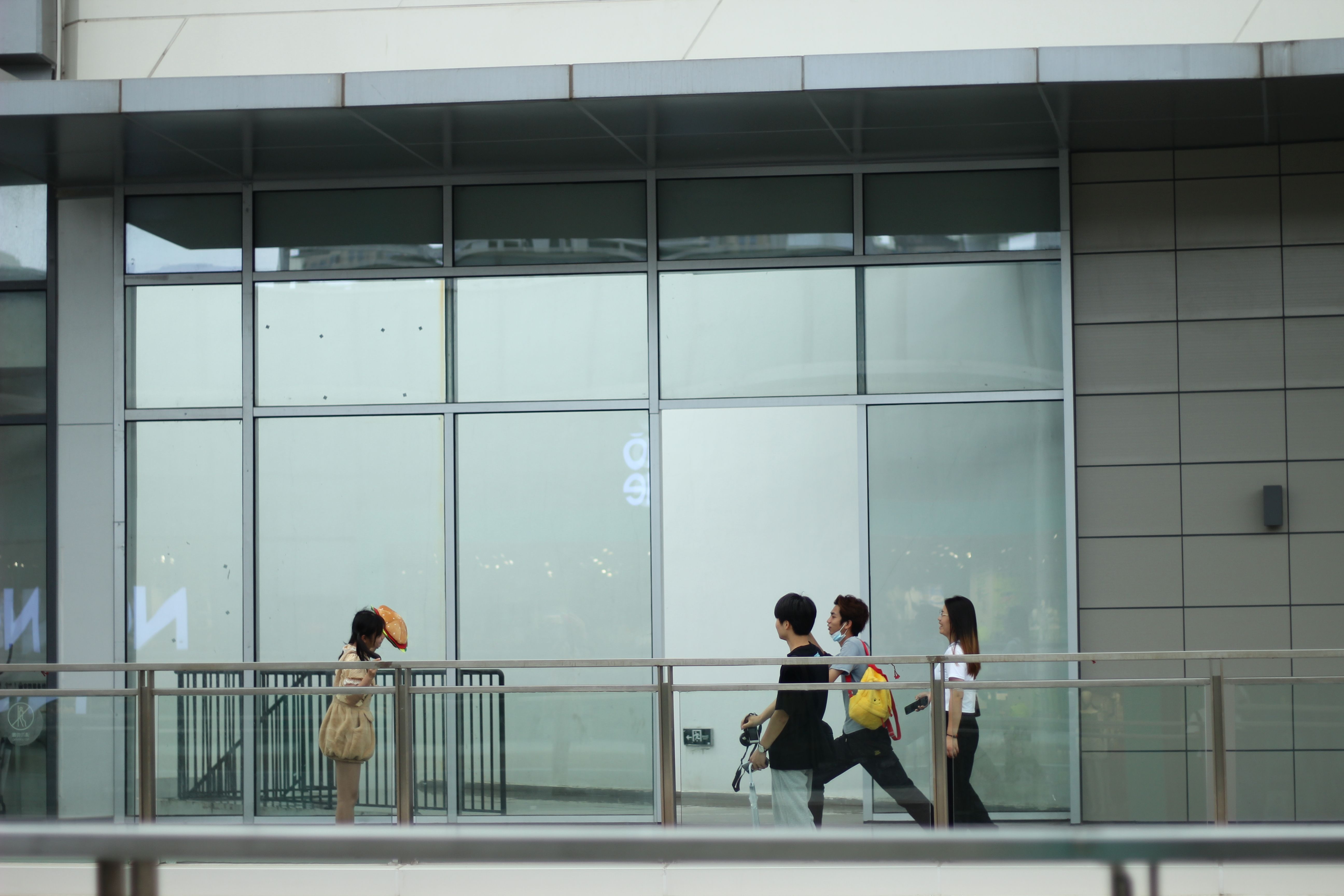 Man Walking on the Stairs of a Modern Building · Free Stock Photo