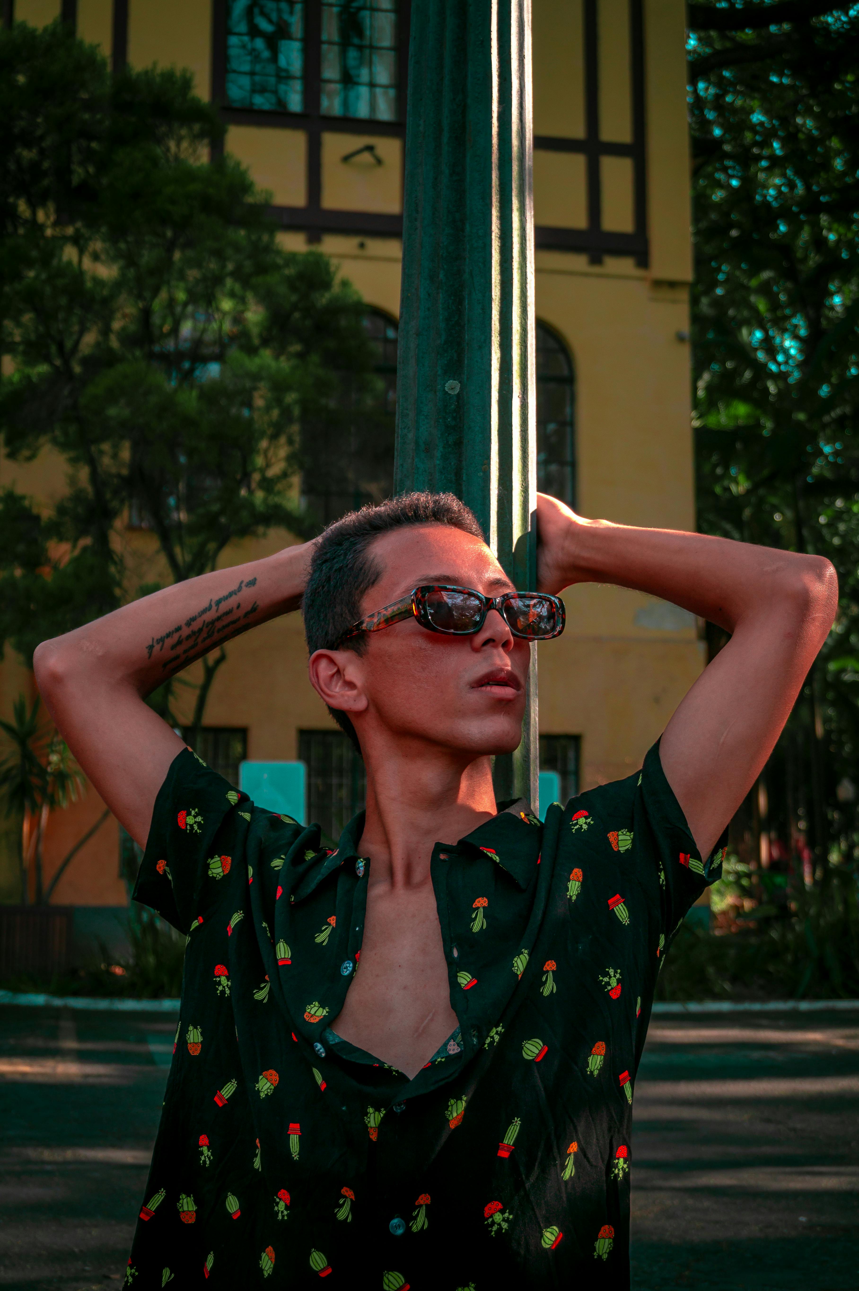 Man with Sunglasses Posing by Street Pole · Free Stock Photo