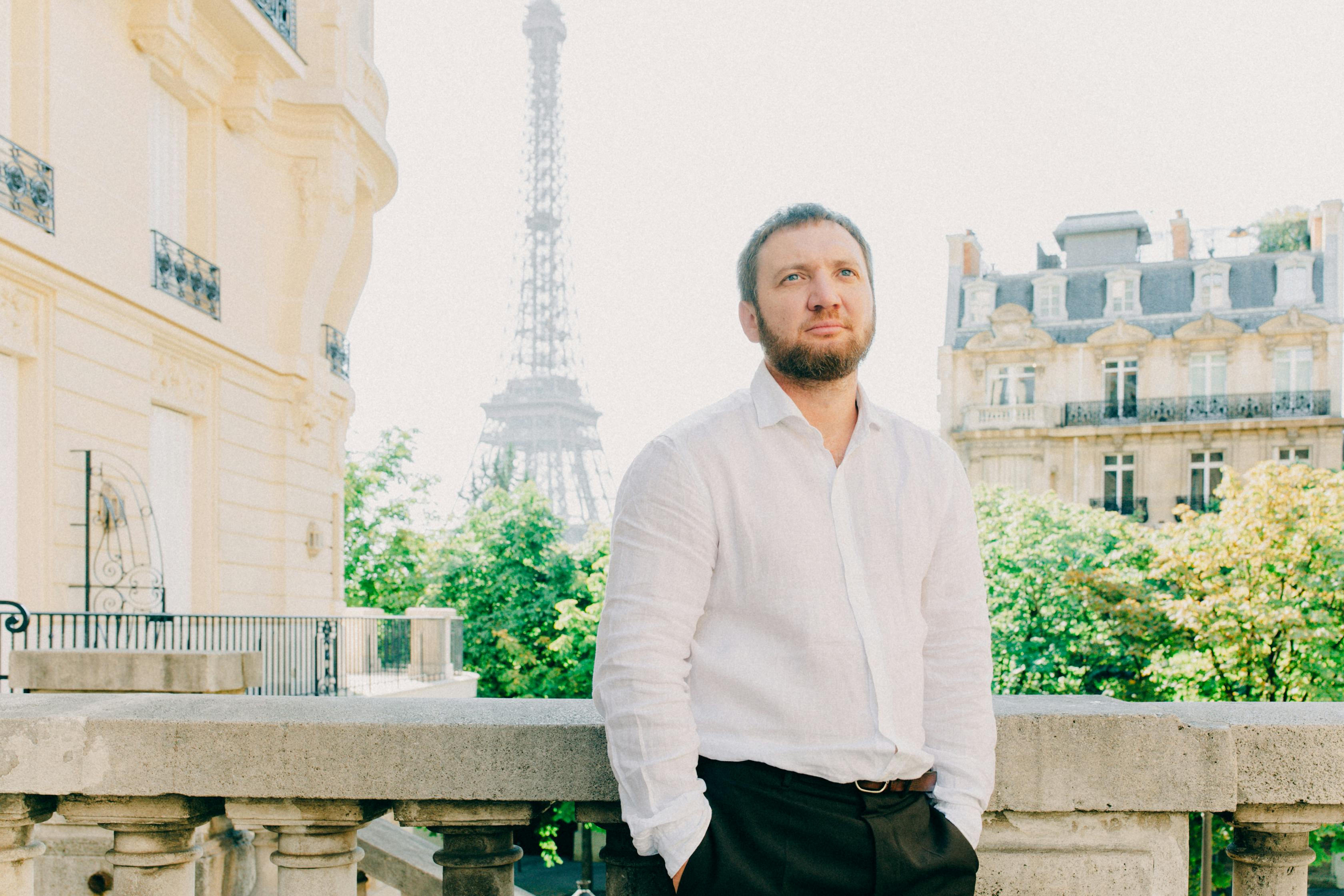 Man on a Stone Bridge in Paris · Free Stock Photo
