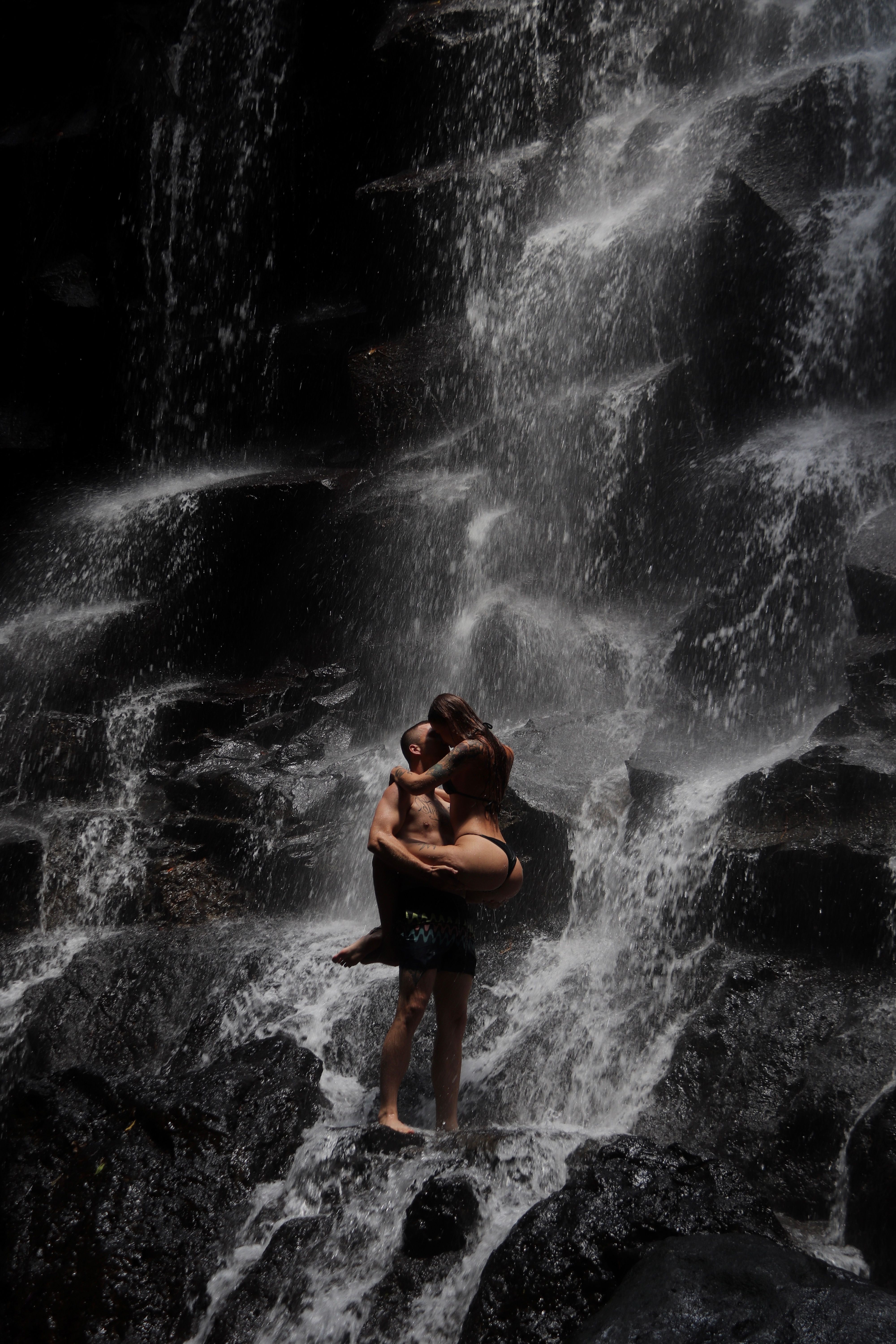 A Couple by a Waterfall · Free Stock Photo