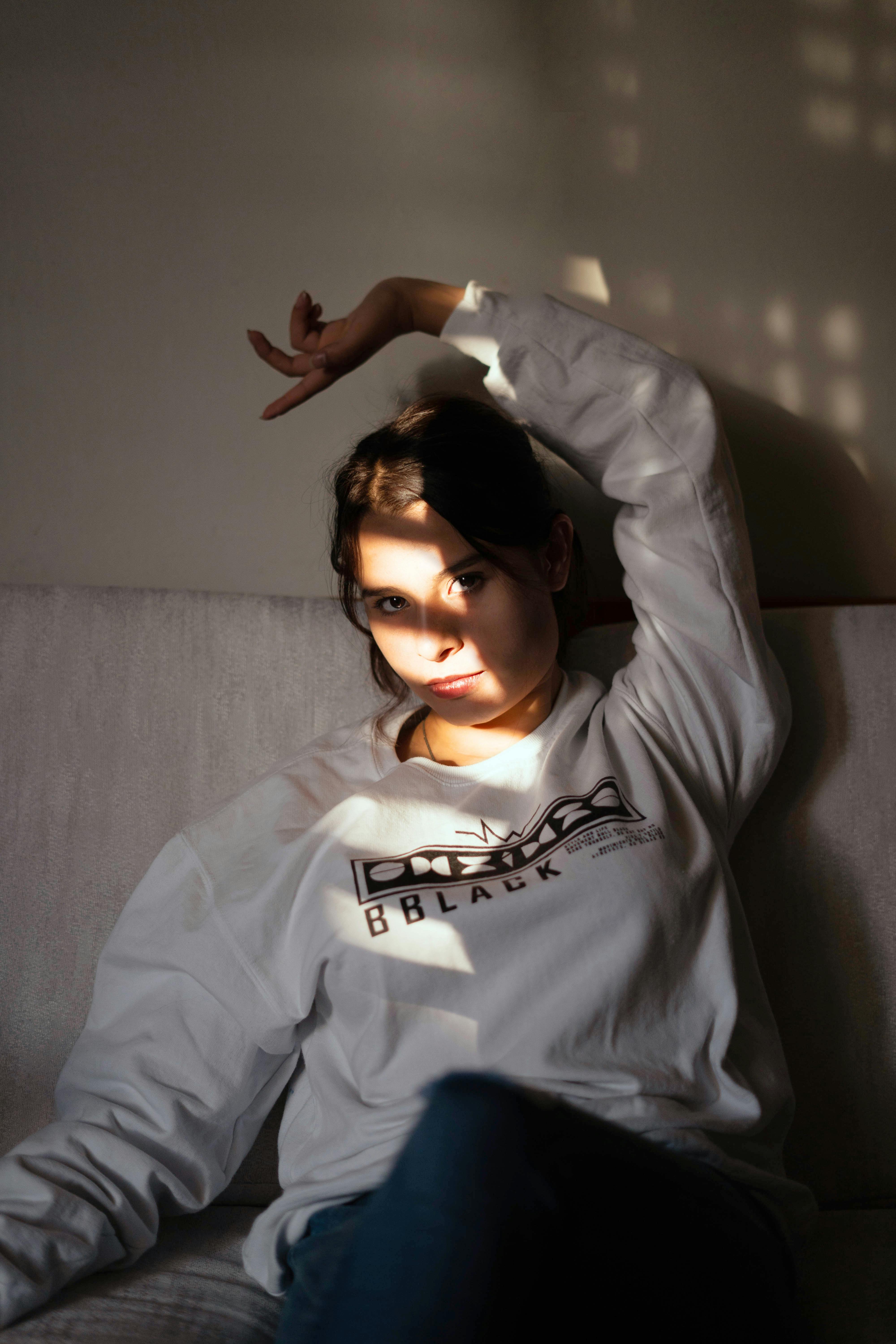 Woman Raising her Arm over her Head · Free Stock Photo