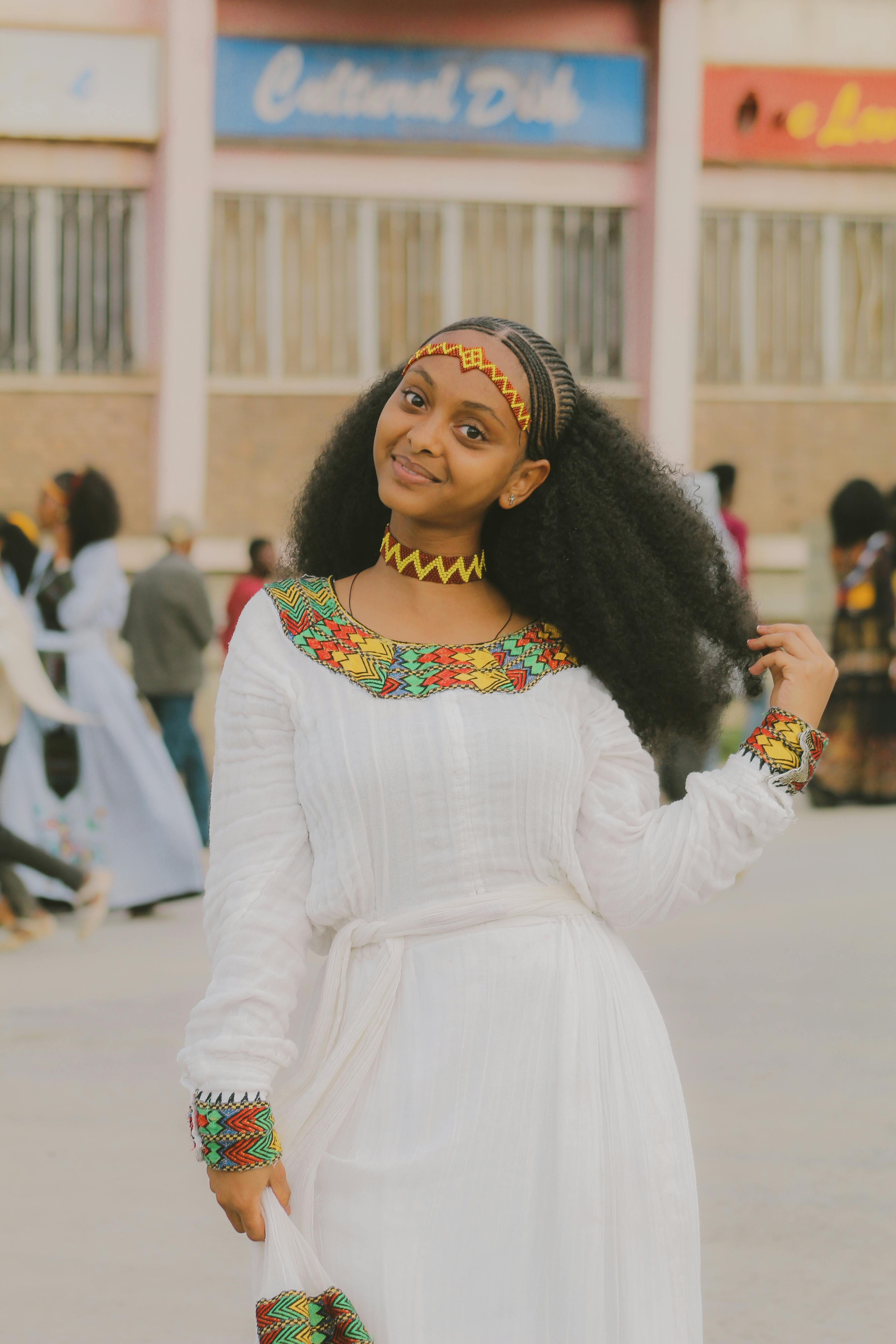 Smiling Woman in White, Traditional Clothing · Free Stock Photo