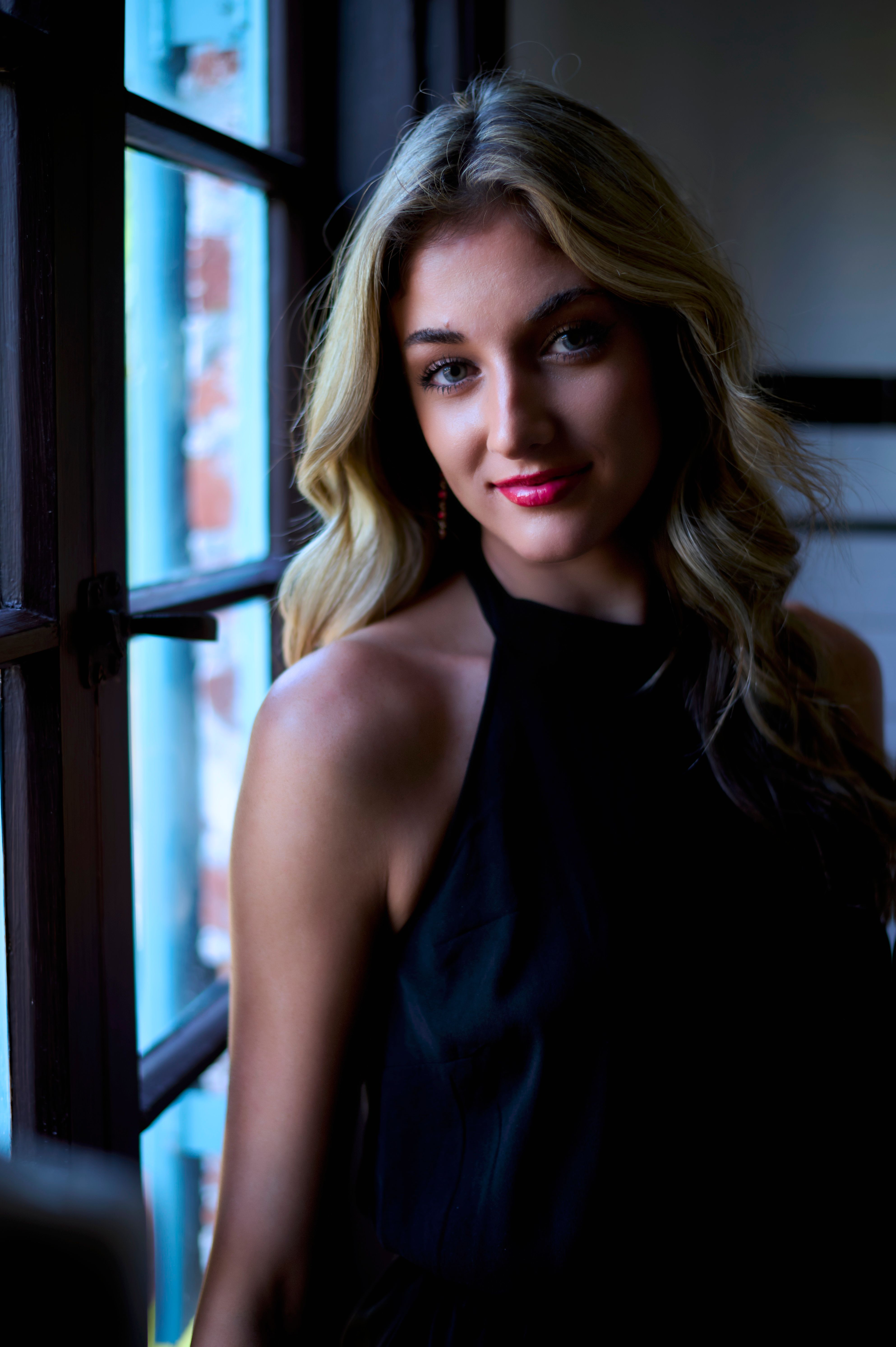 Woman in Black Halter Top Looking Up · Free Stock Photo