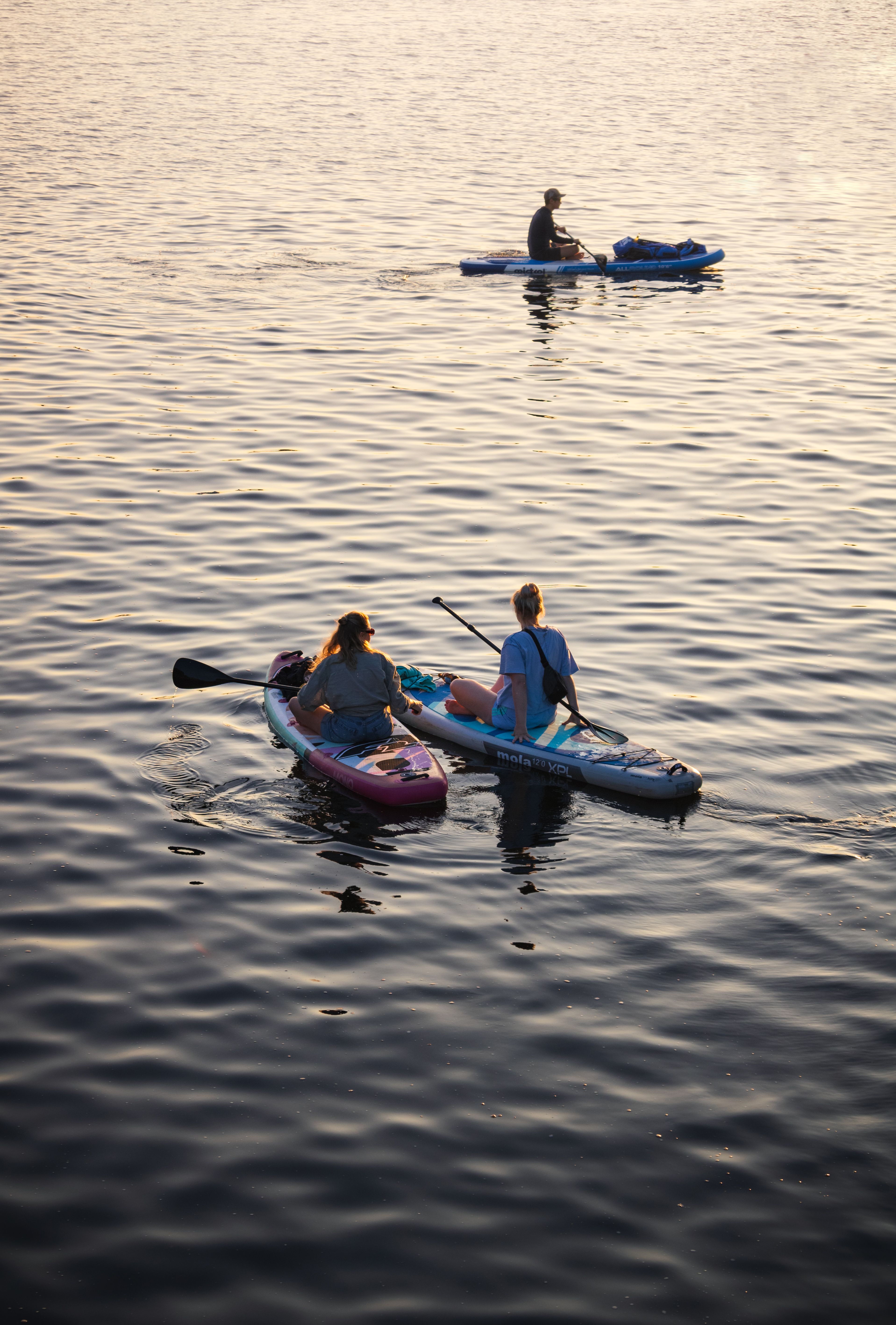 Two people are paddling in a kayak on a lake · Free Stock Photo