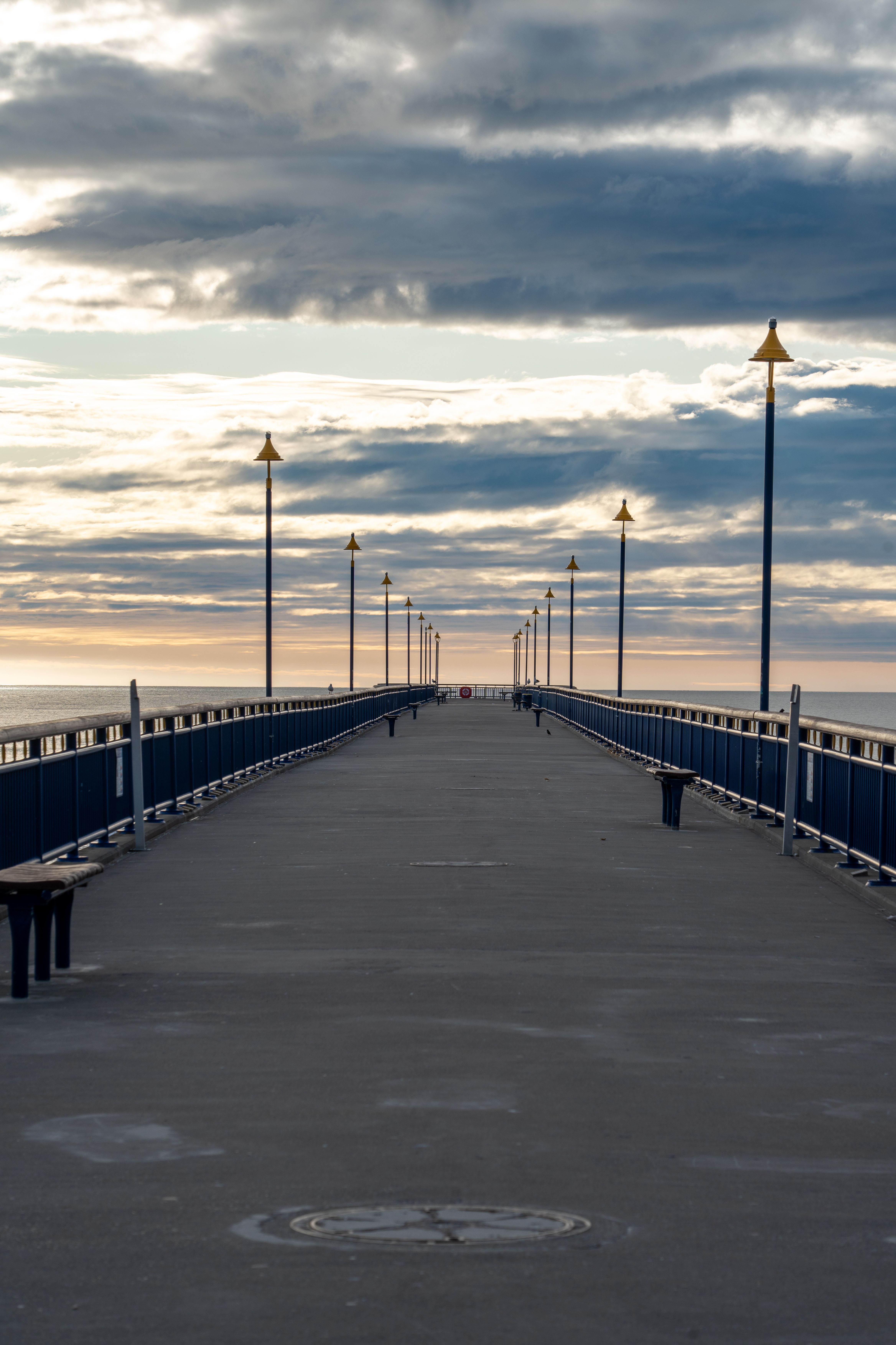 Empty Pier on Sea Shore at Sunset · Free Stock Photo