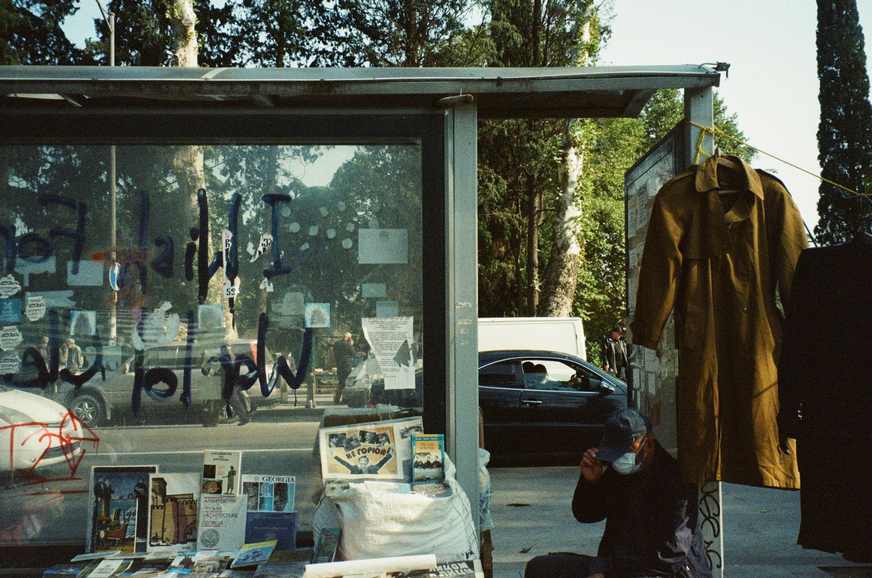Street Vendor on Bus Stop · Free Stock Photo