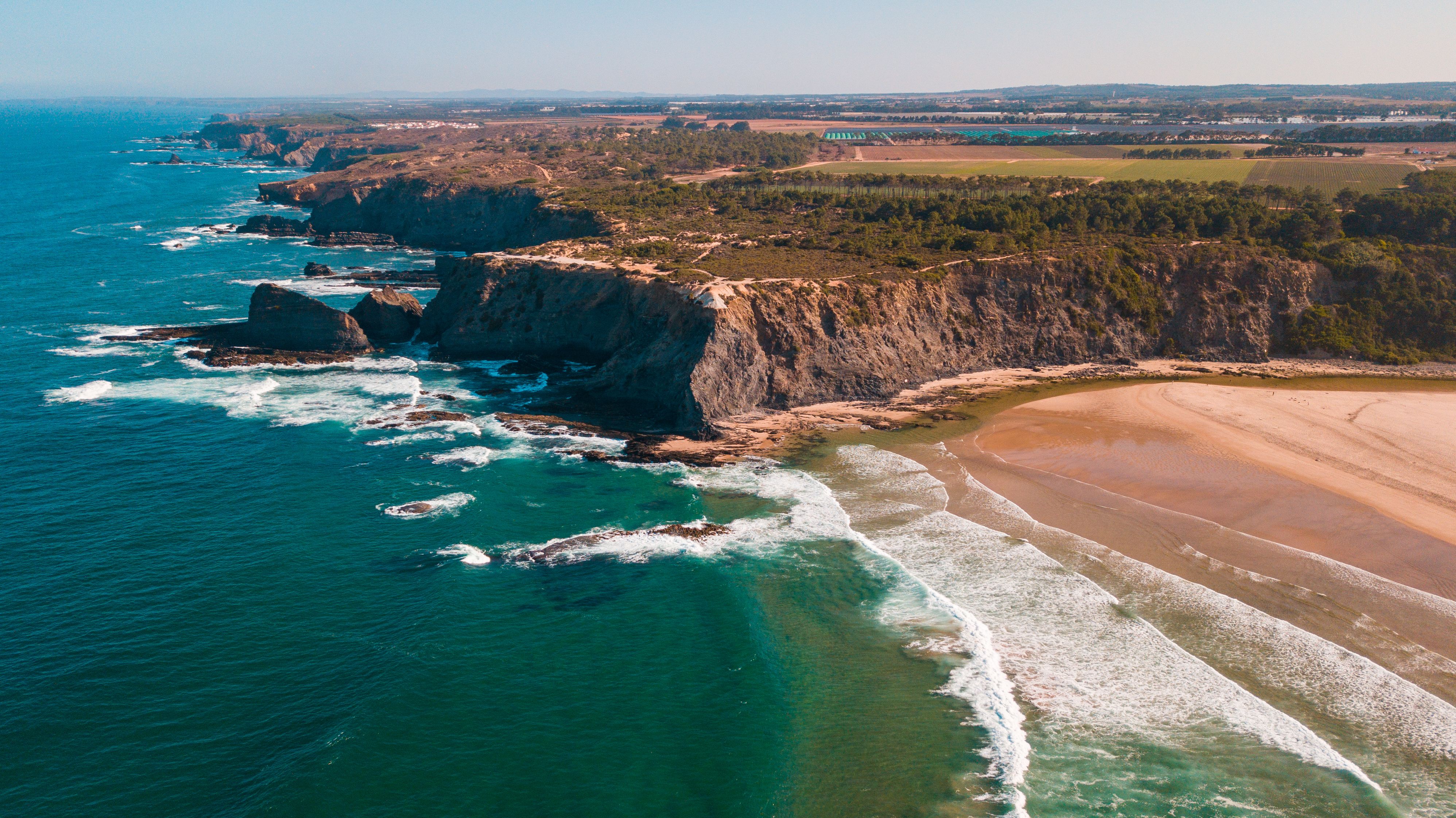 Aerial View of Cliffs and Beach on the Ocean Coast · Free Stock Photo