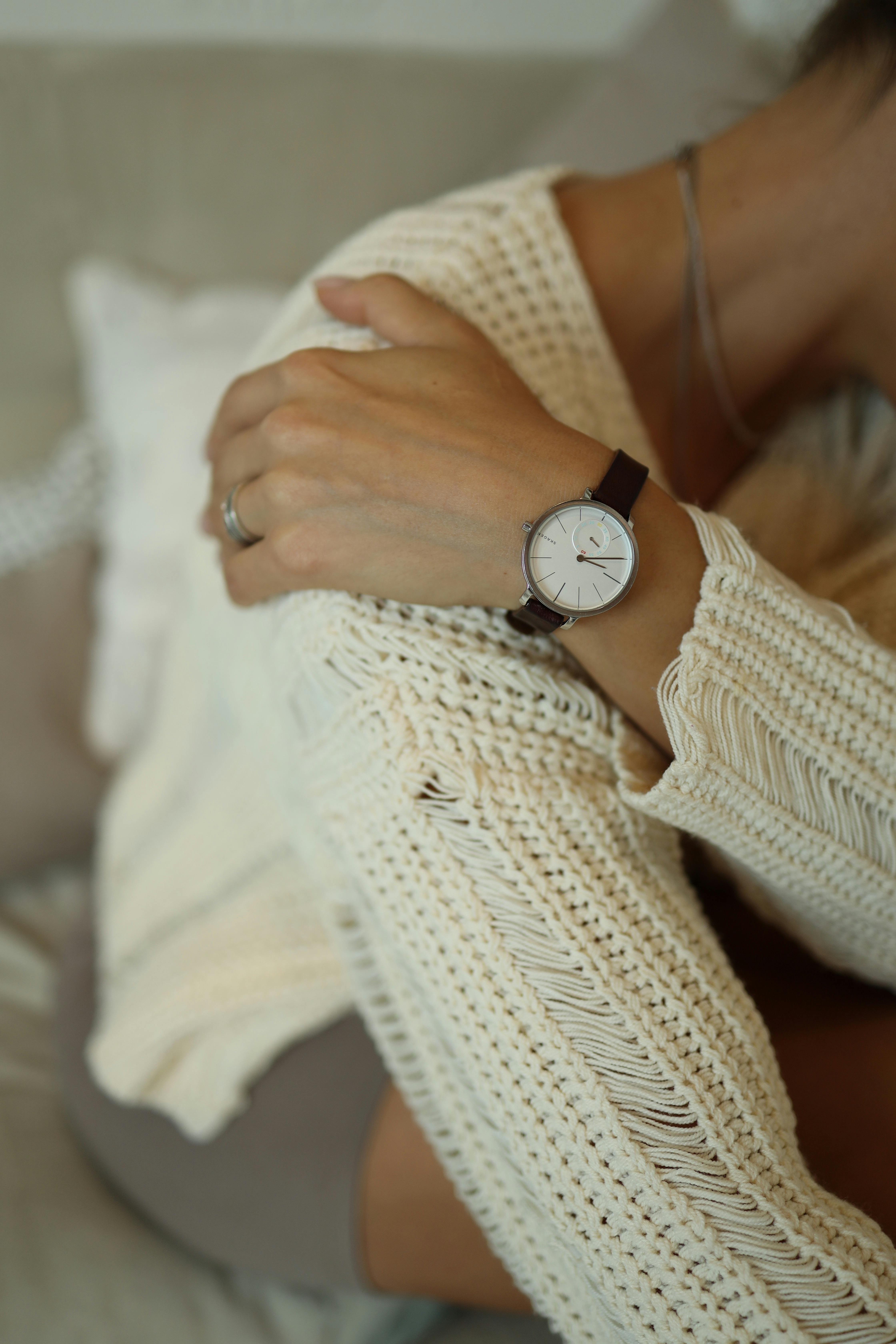 Woman Wearing Beige Crochet Sweater and Round White Analog Watch ...