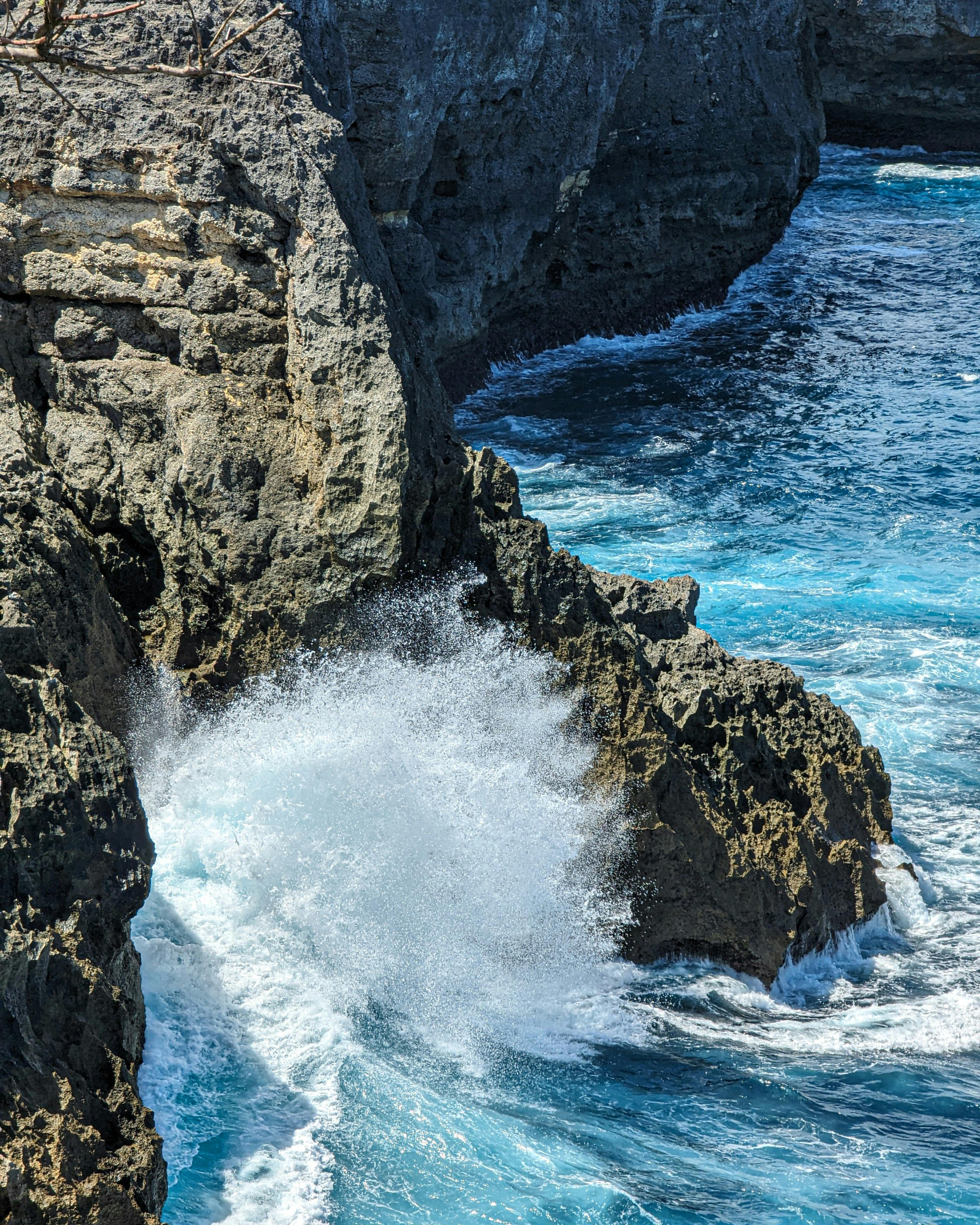 Closeup of Blue Sea Water Splashing against a Rocky Coast · Free Stock ...