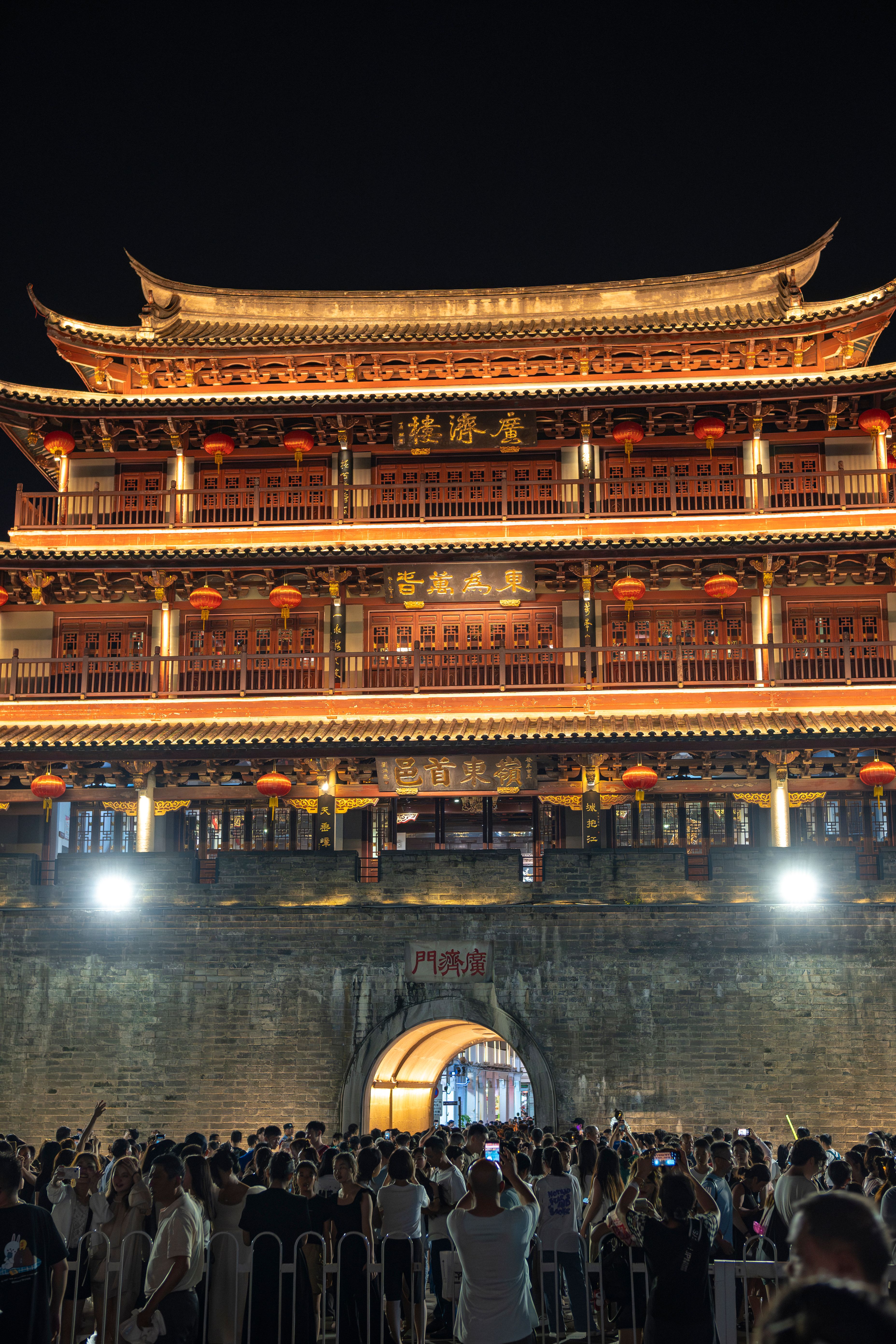 Photo of an Illuminated Chinese Place, and Crowd on a City Street at ...