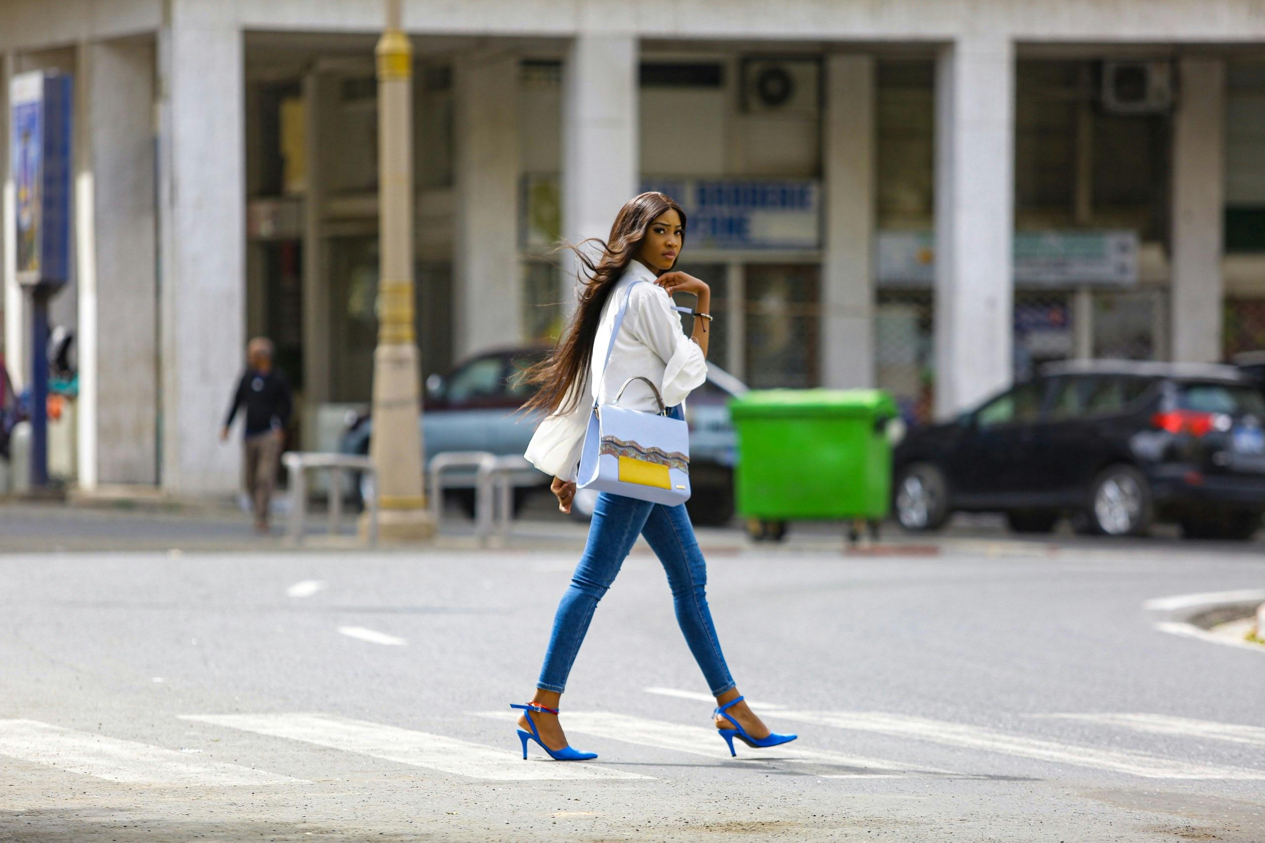 Photo of a Long Haired Woman Wearing High Heels, Walking on a City ...