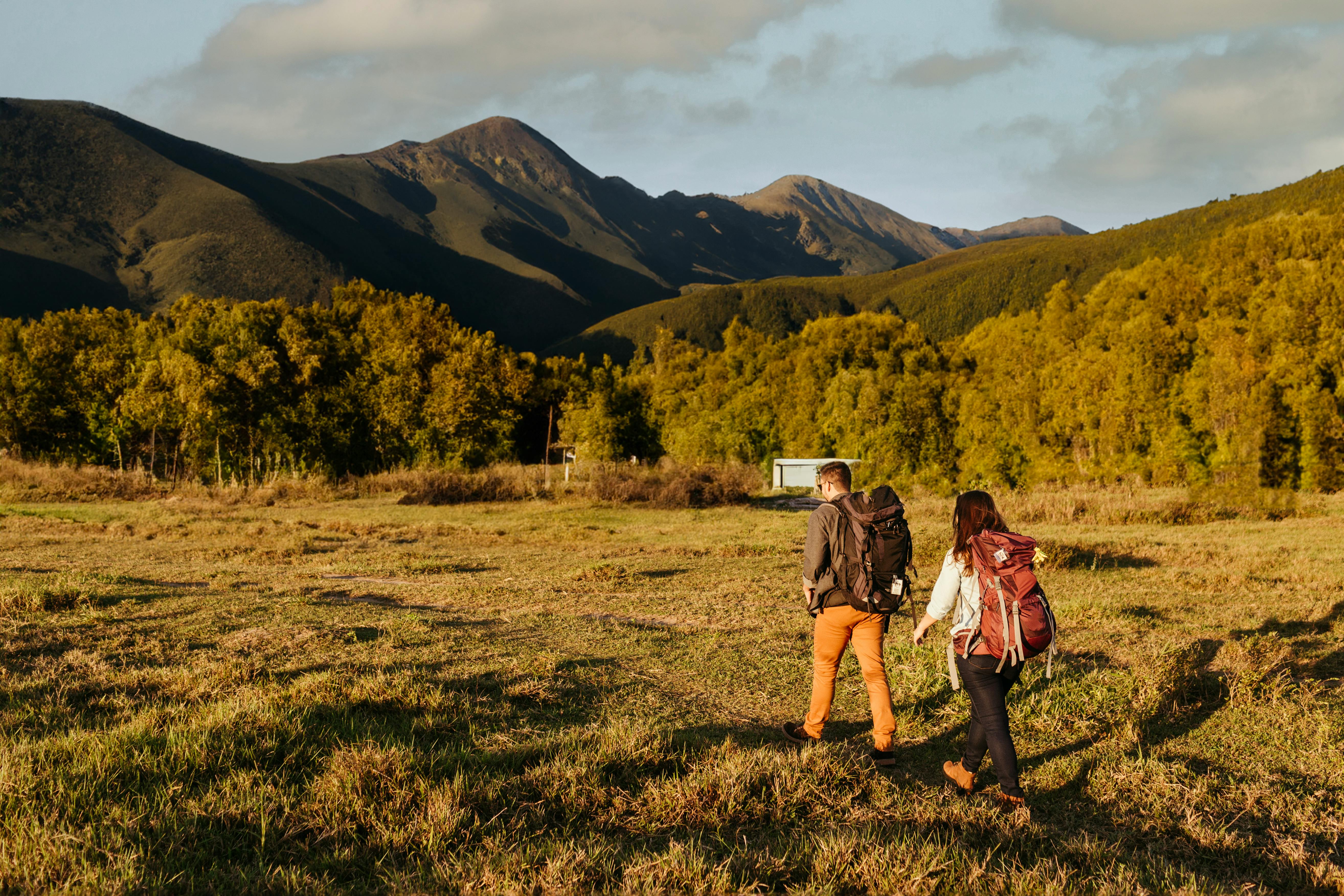 Two People Hiking with Backpacks · Free Stock Photo