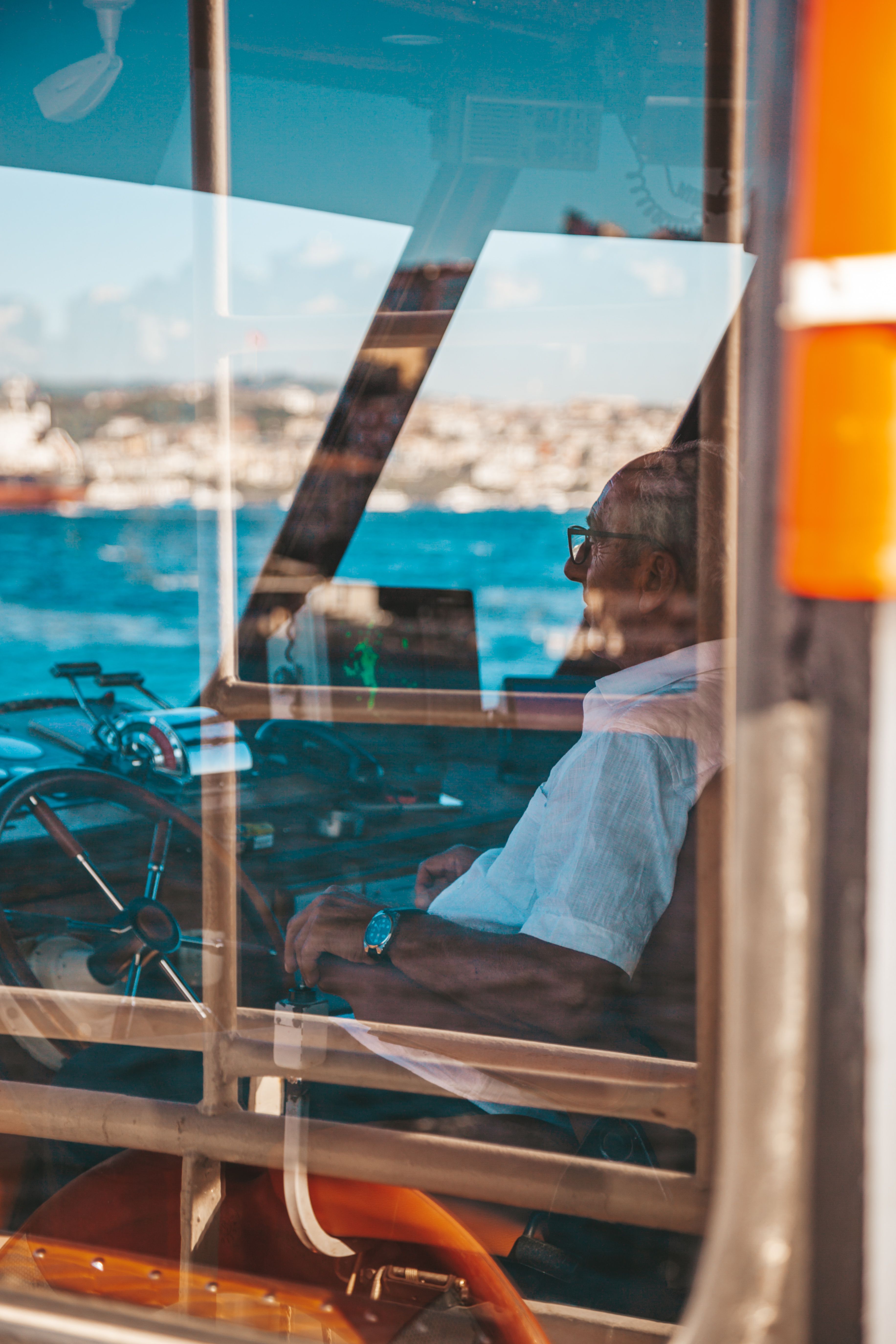 Captain of a Ship Behind a Window · Free Stock Photo