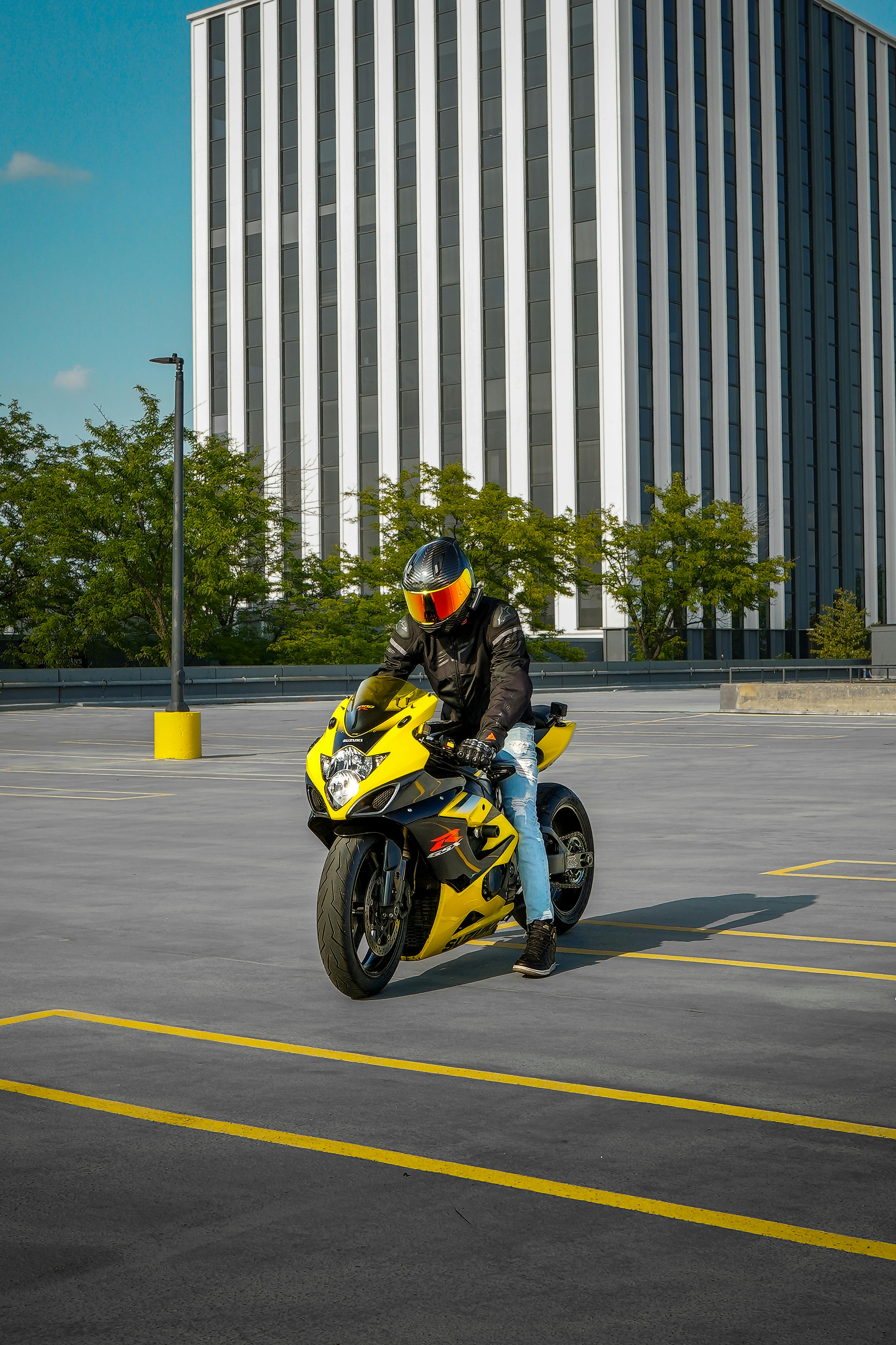 Person on Motorcycle on Parking Lot · Free Stock Photo