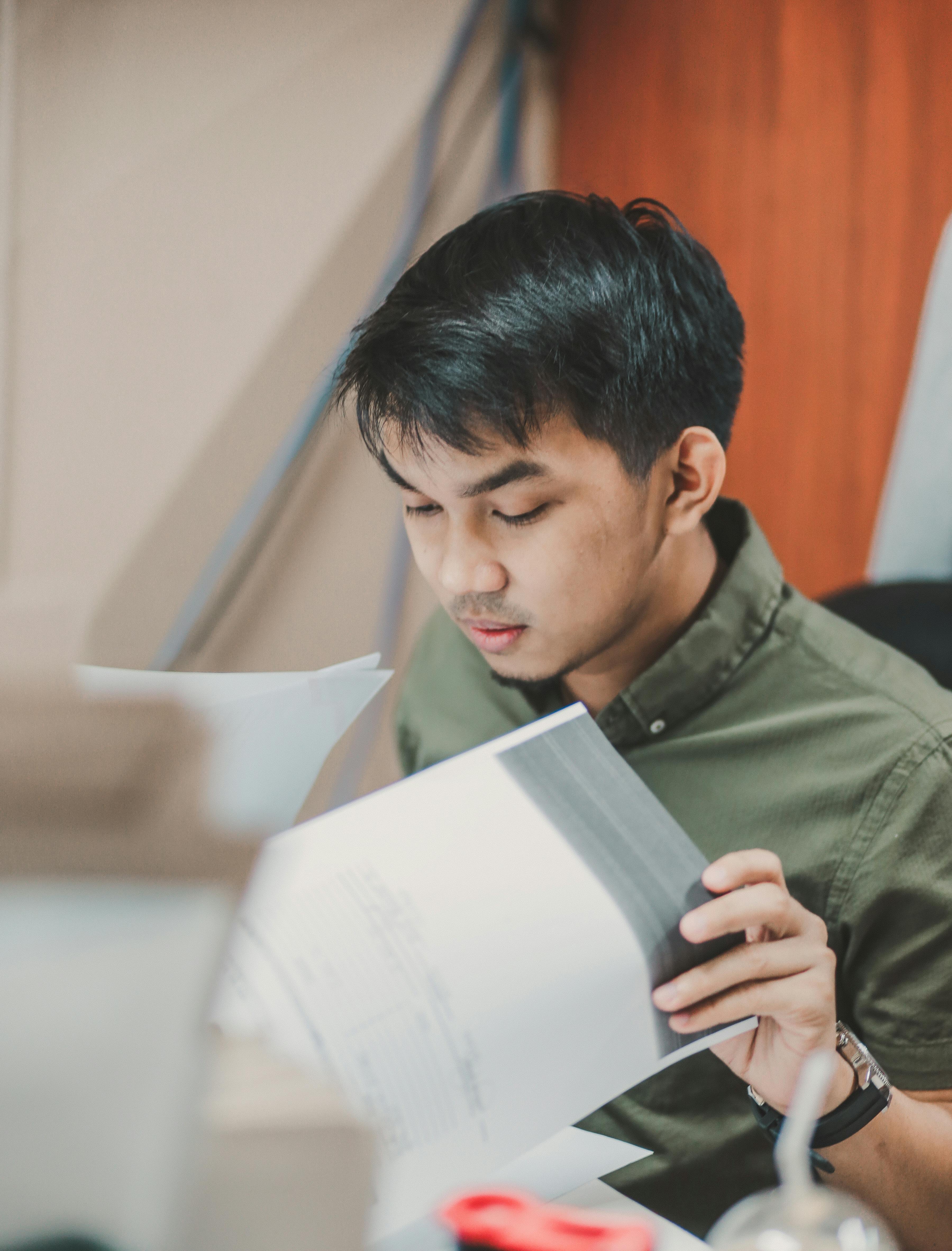 Man Reading Papers · Free Stock Photo