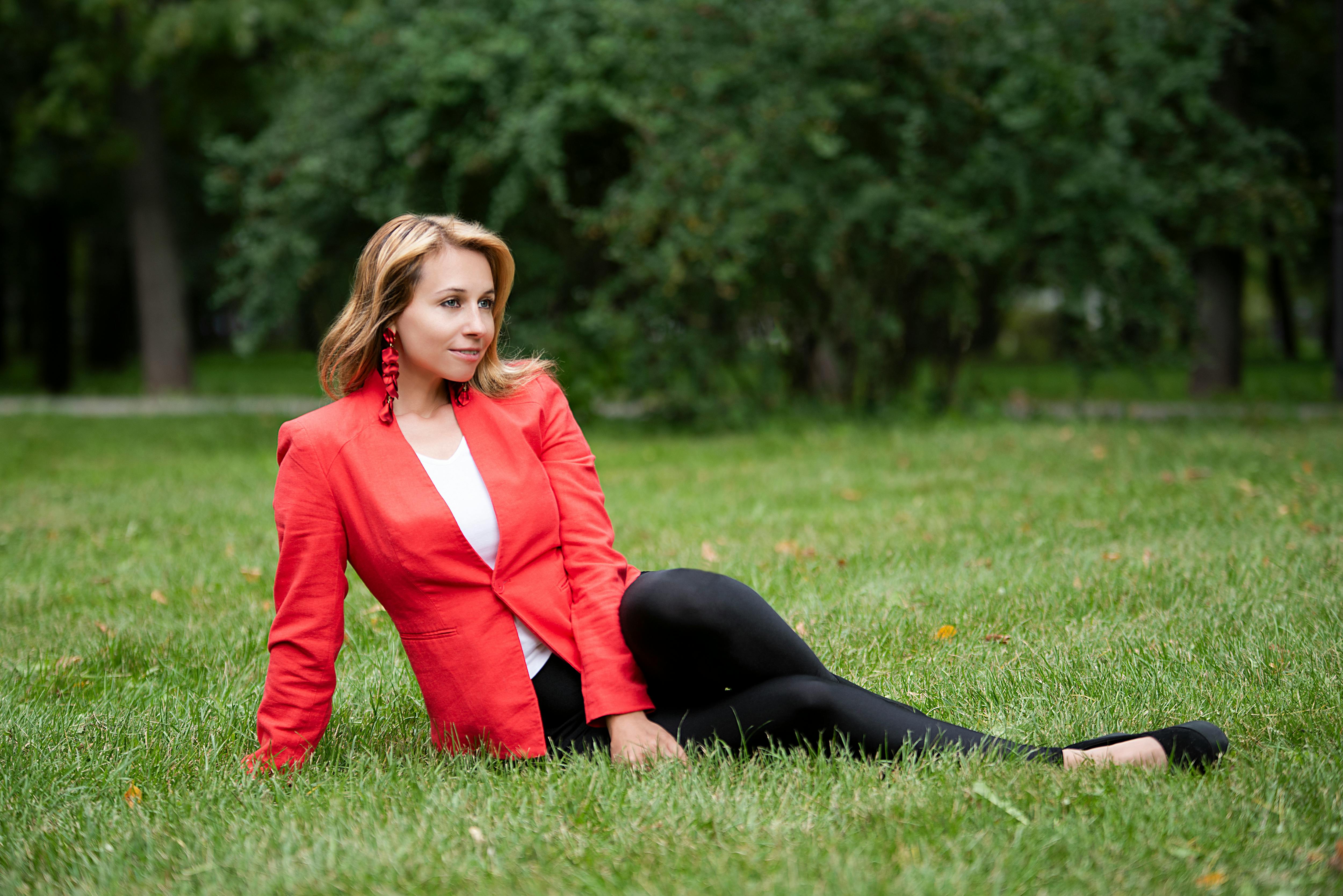 Woman Wearing Red Blazer Posing in a Park · Free Stock Photo