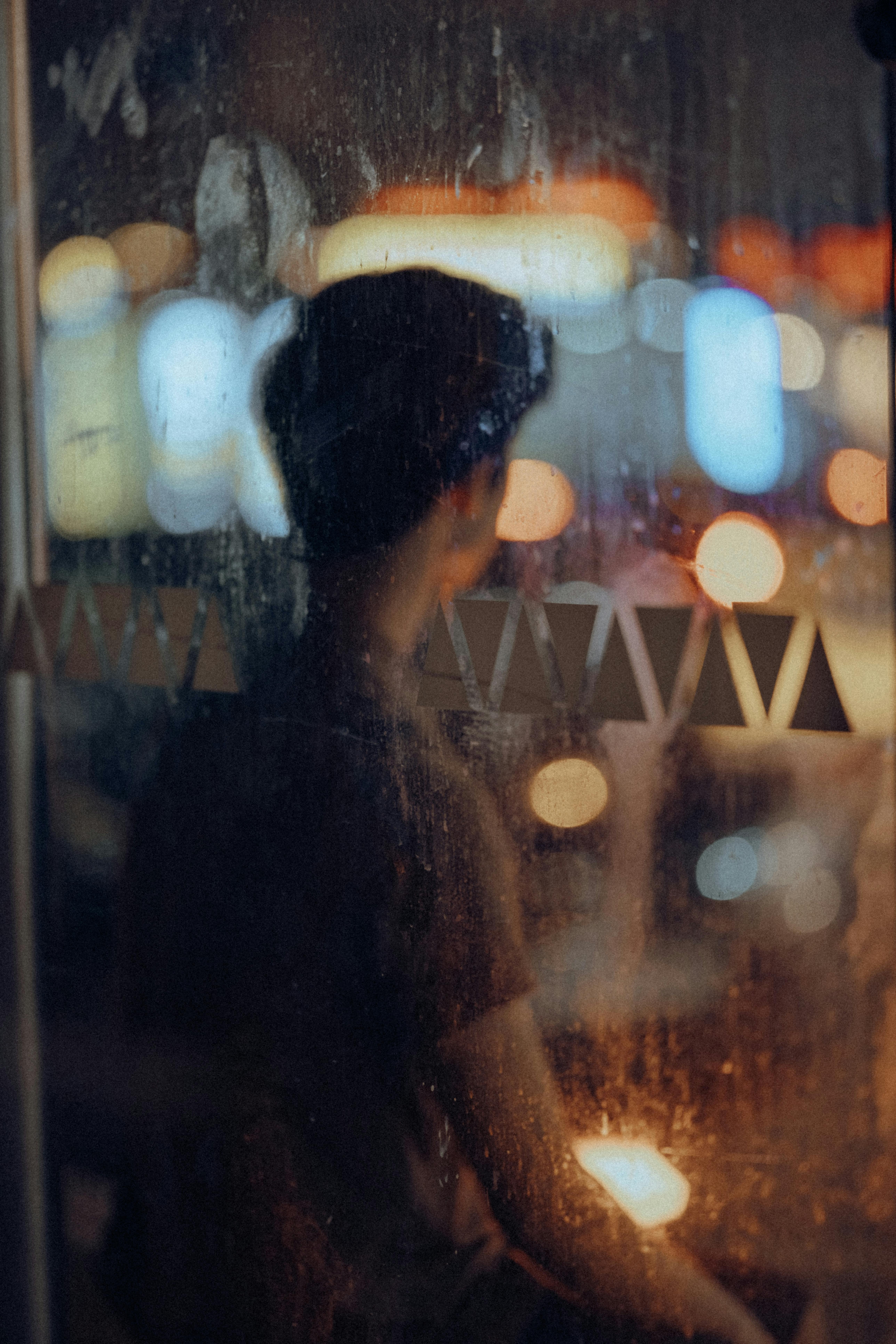 A Man Standing Behind a Window · Free Stock Photo
