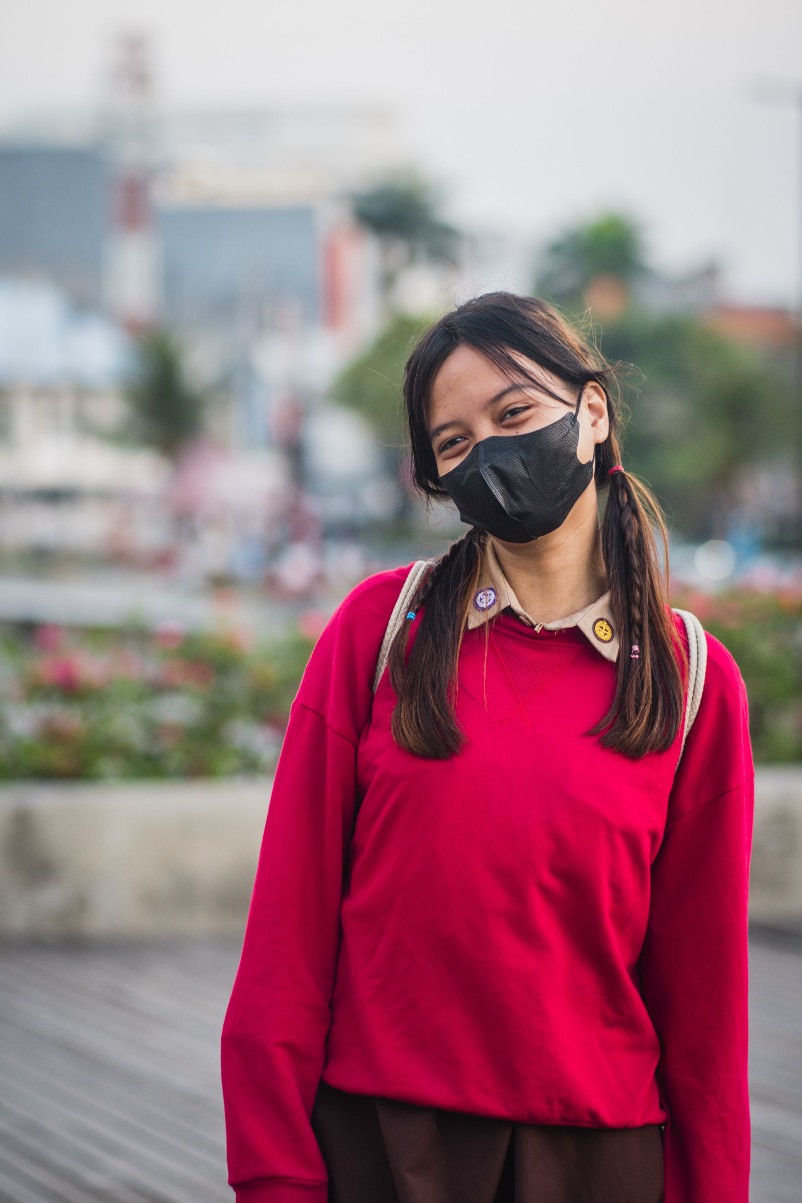 Woman in Pink Sweater Wearing Face Mask · Free Stock Photo