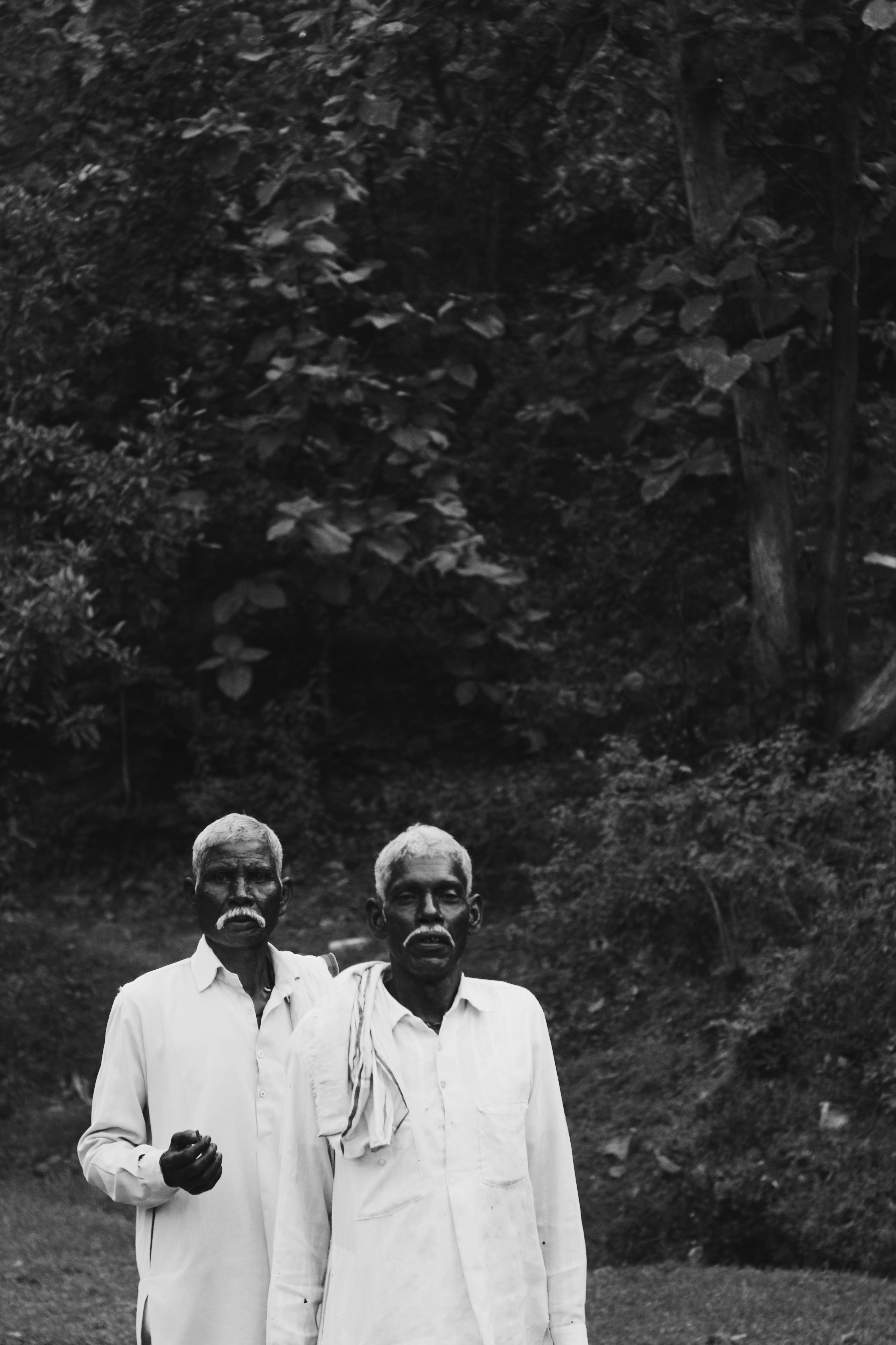 Two Men Standing Side by Side · Free Stock Photo