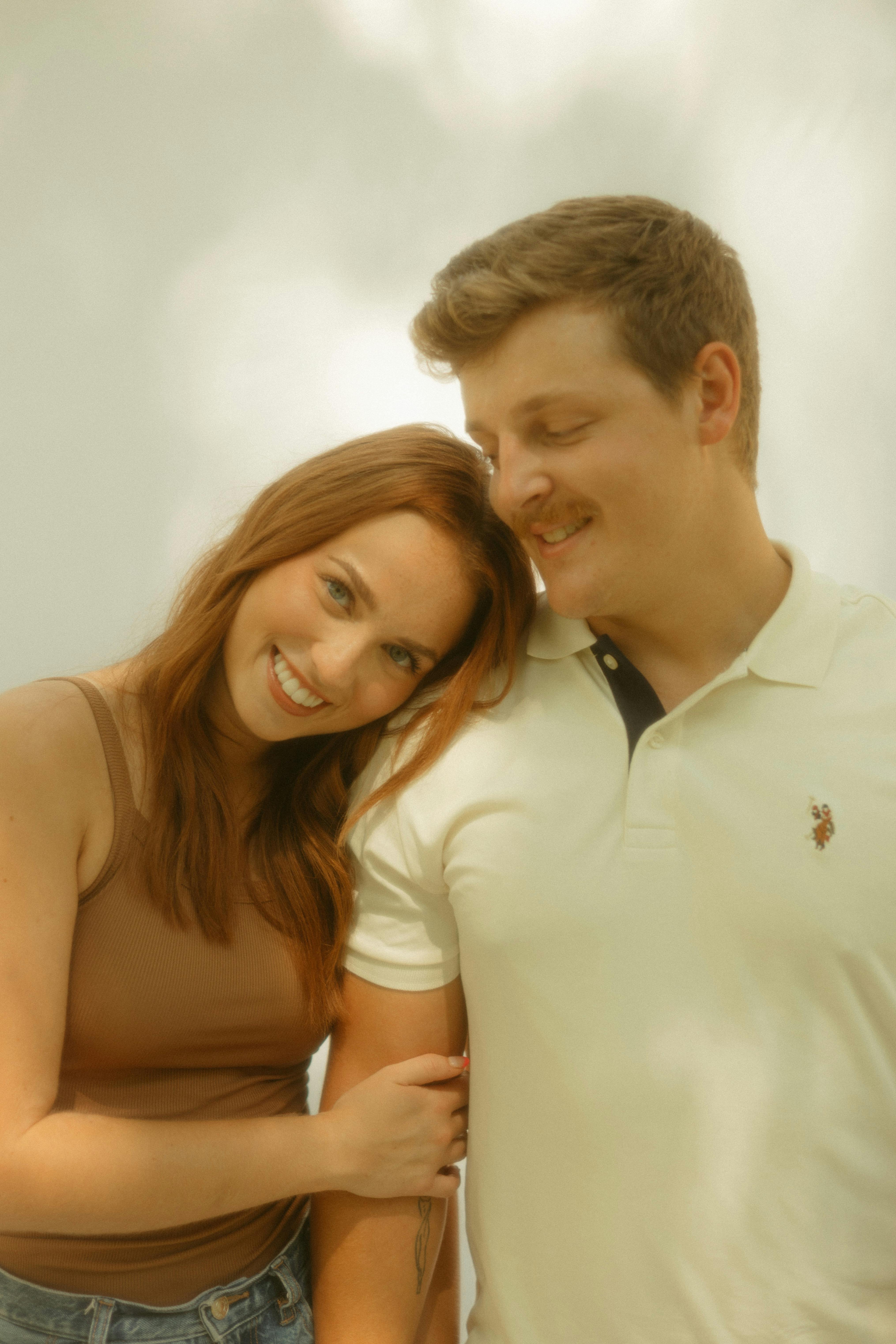 A Woman Putting Her Head on Her Partners Shoulder and Smiling · Free ...