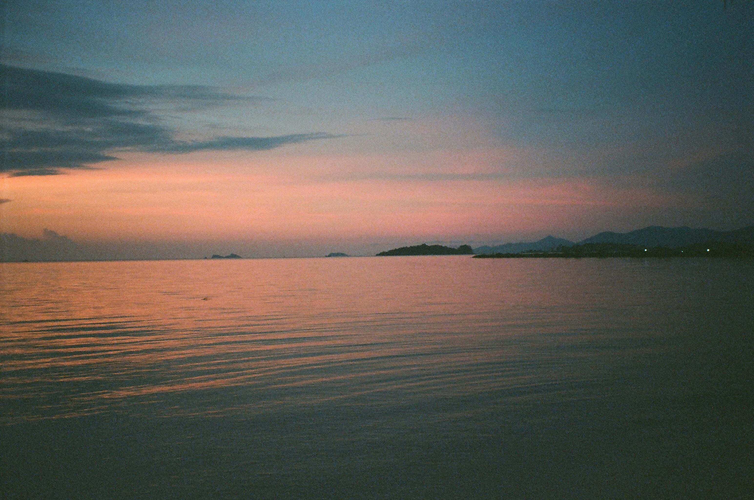 Grainy Photo of Sunset over Lake · Free Stock Photo